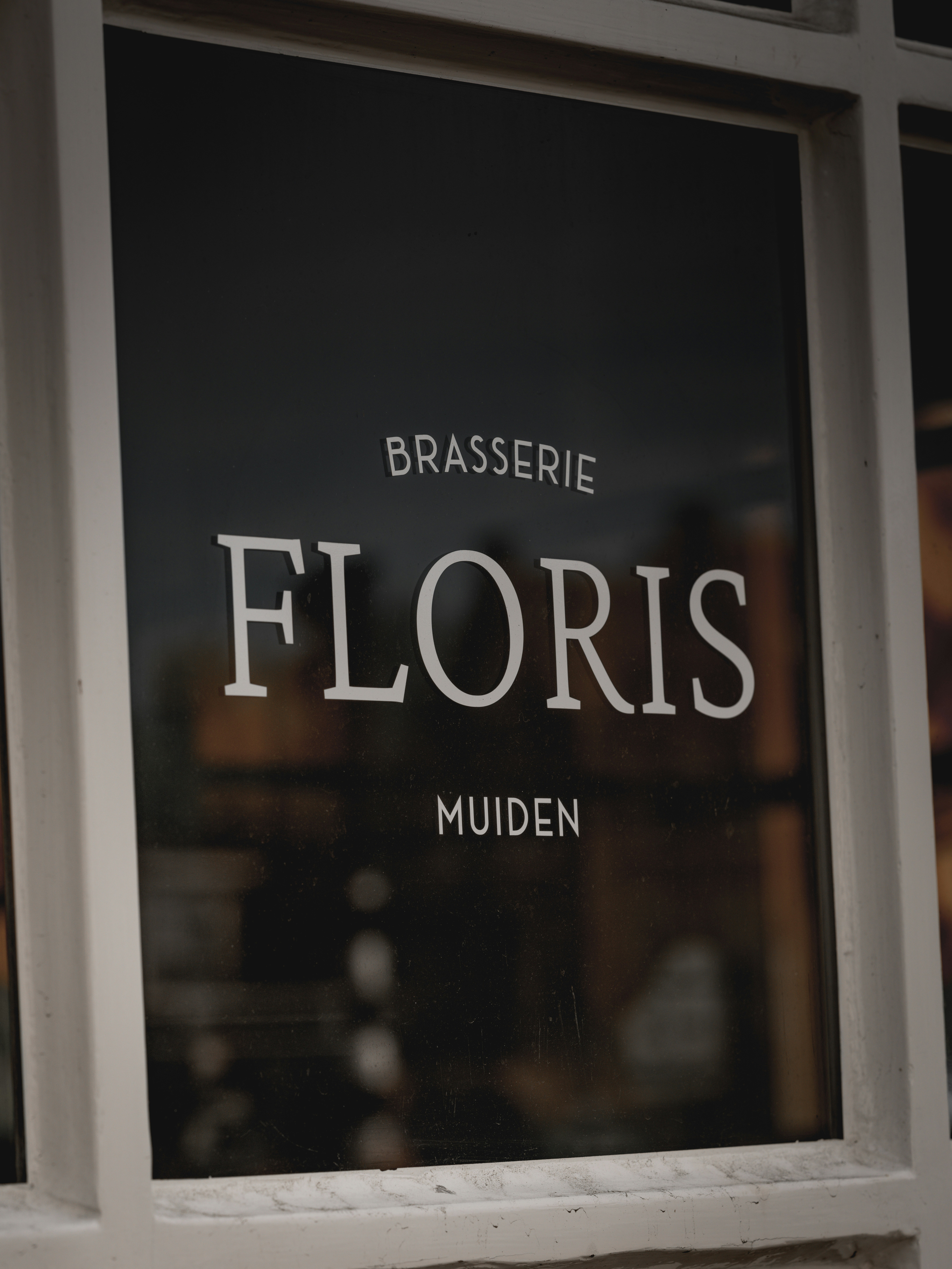 Floris Café Window: Elegant Script Across Glass