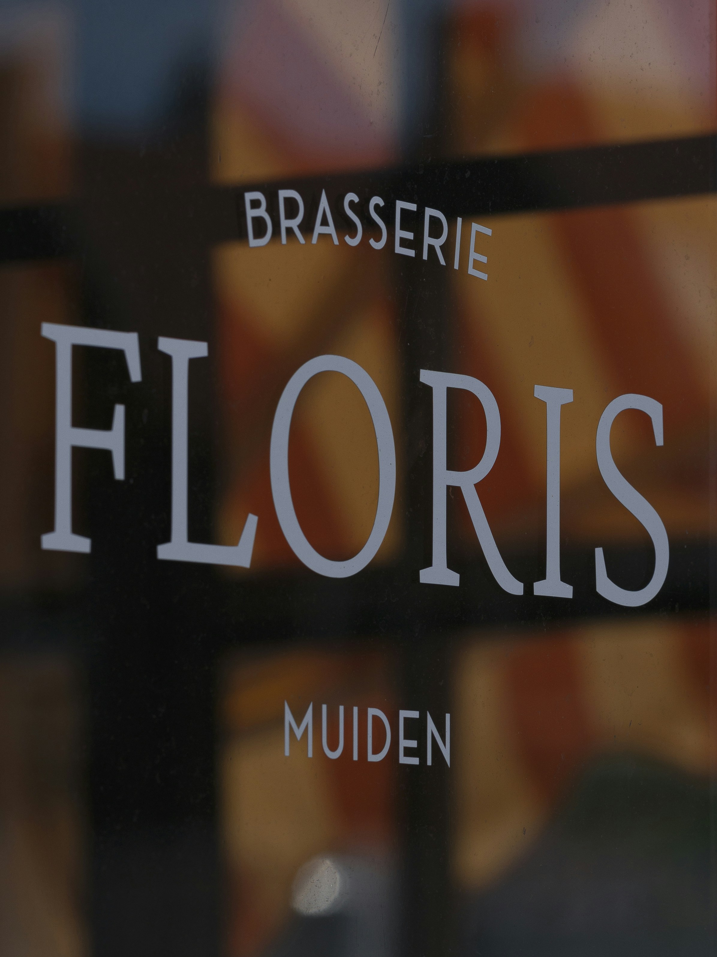 Floris Brasserie Window: Letters and Light on a Glass Pane