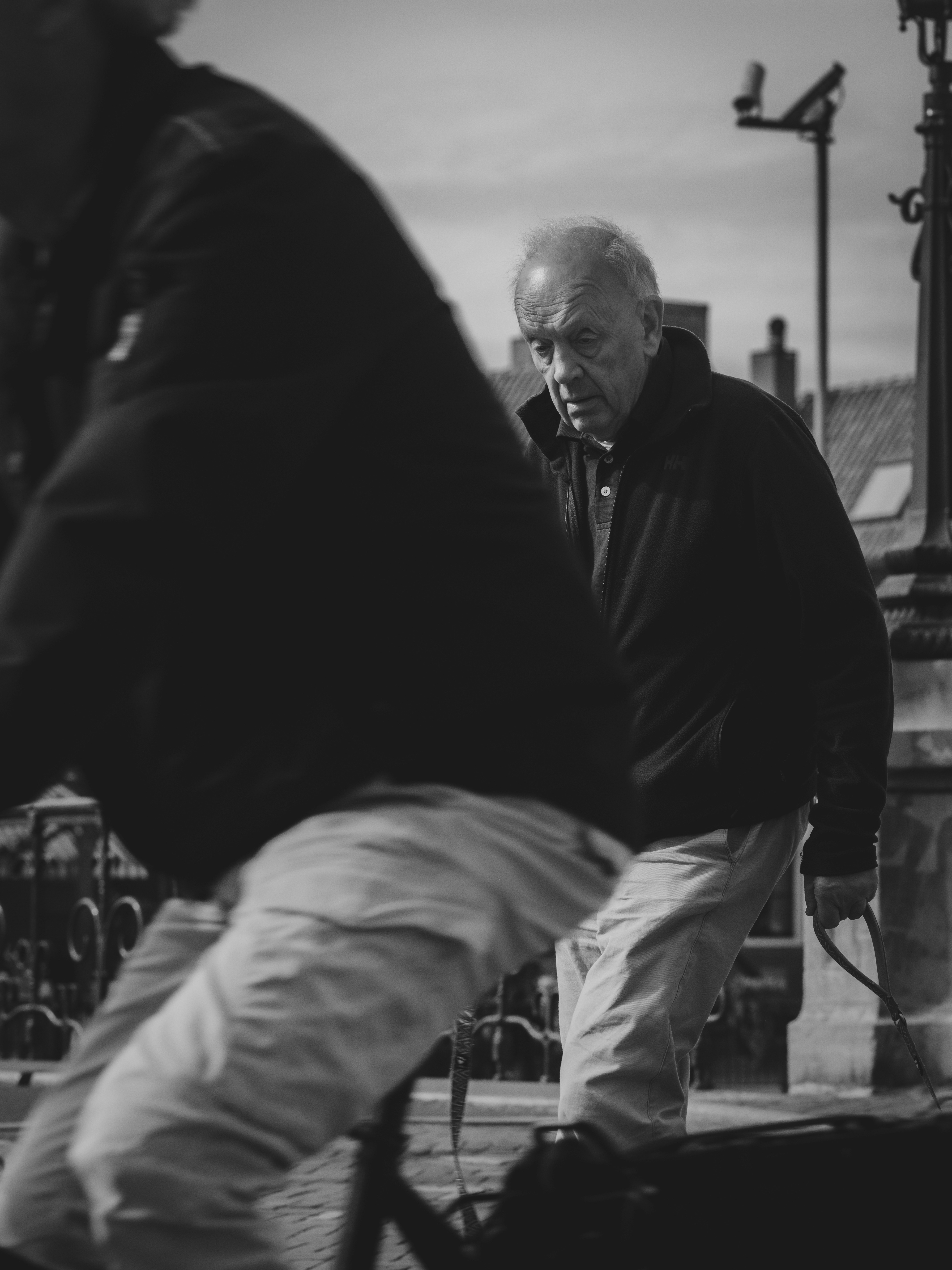 A Quiet Moment on the Docks: The Elderly Man in the Background