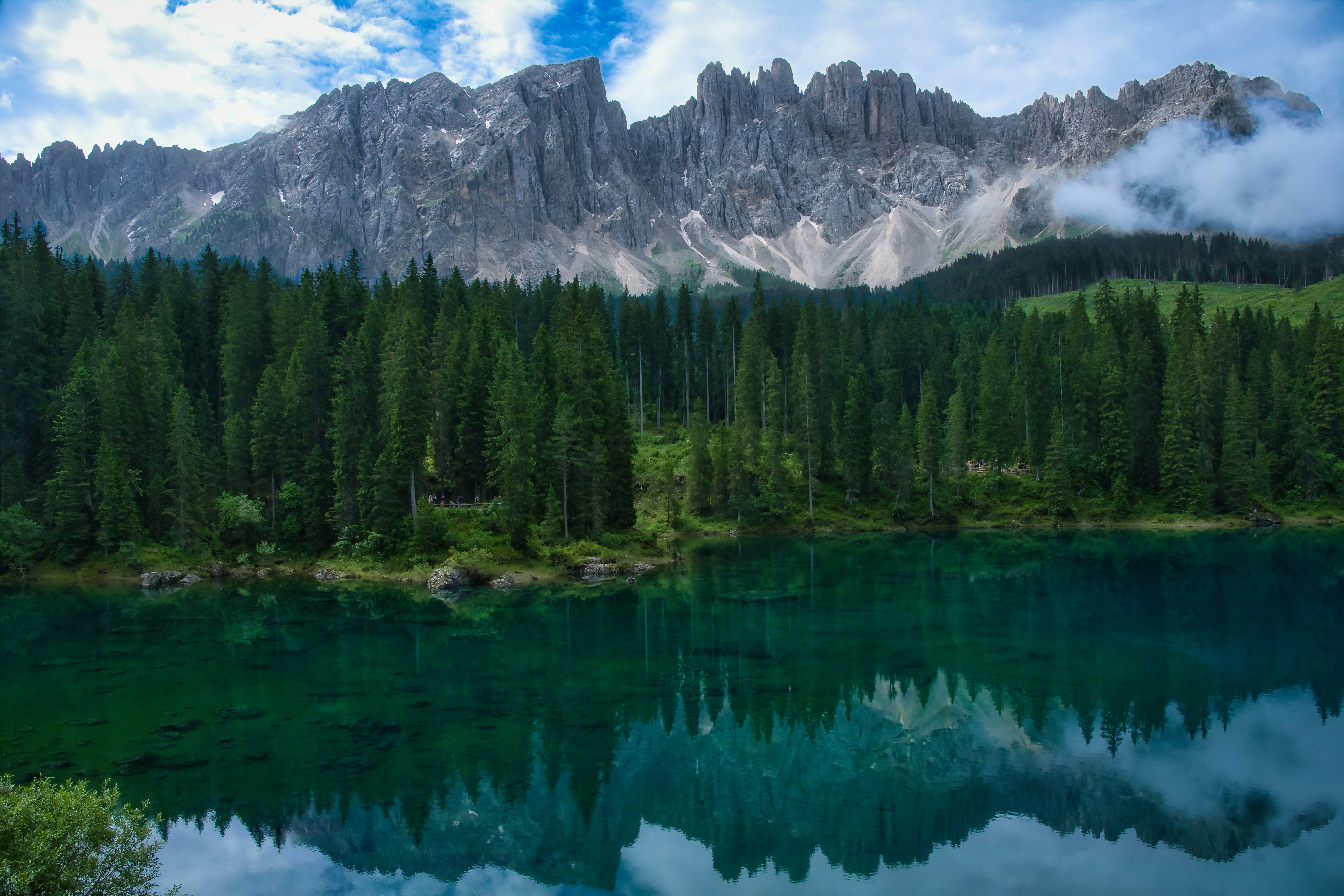 Emerald Mirror: A Mountain Lake Reflects the Forest Ambience