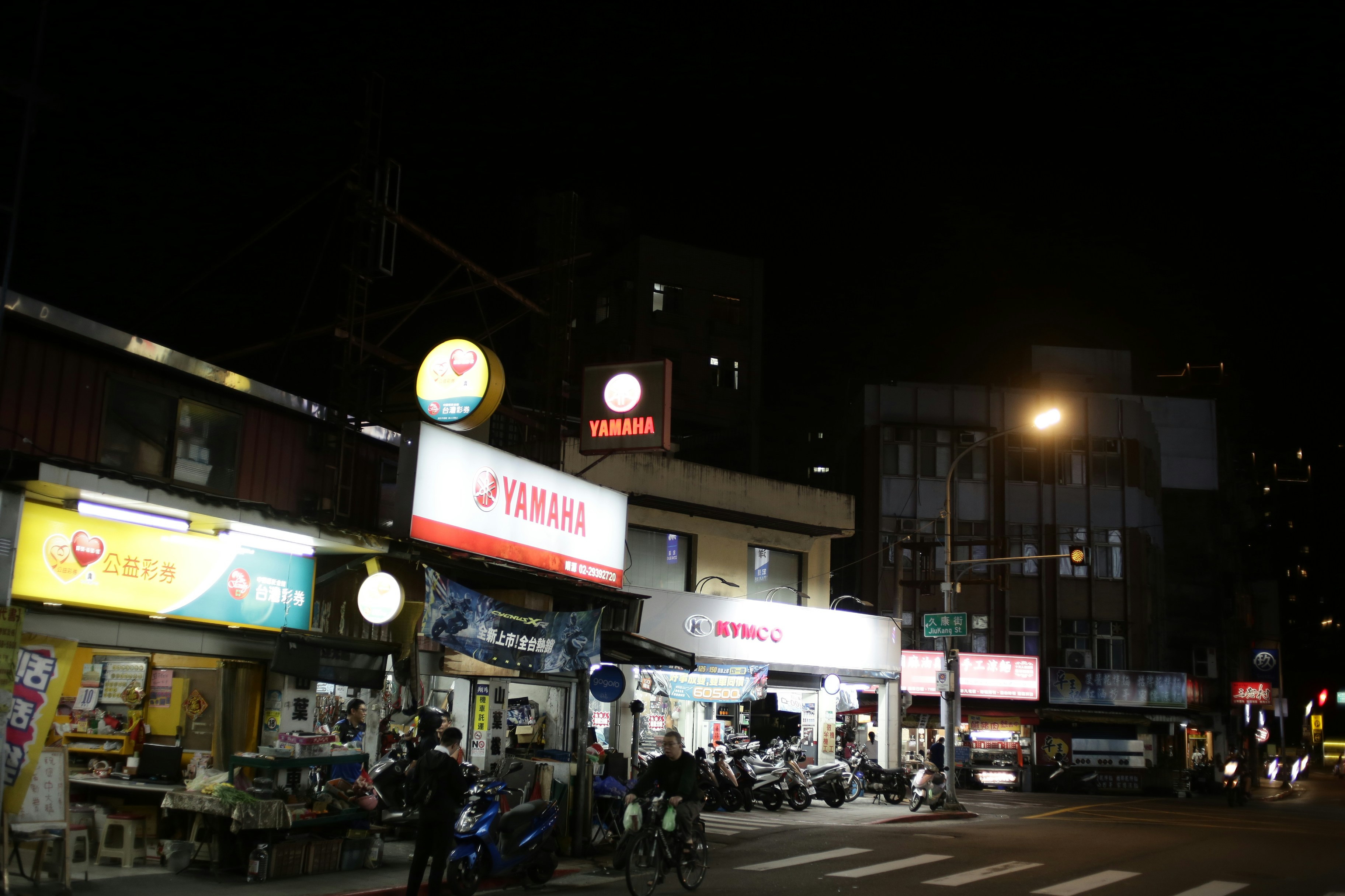 Neon Alley: Yamaha Sign and Night Market Glow
