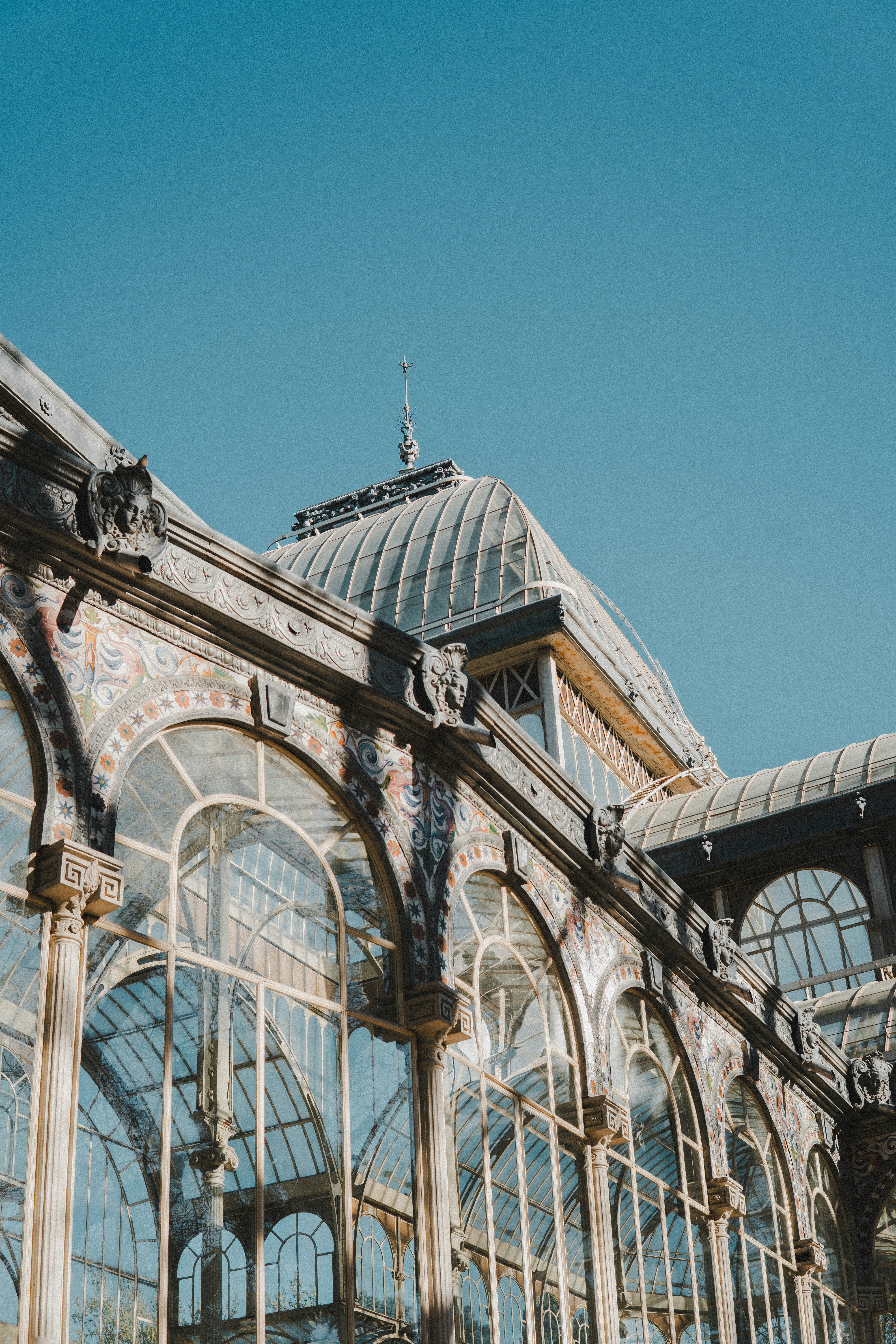 Glass-and-stone Conservatory Under a Clear Sky