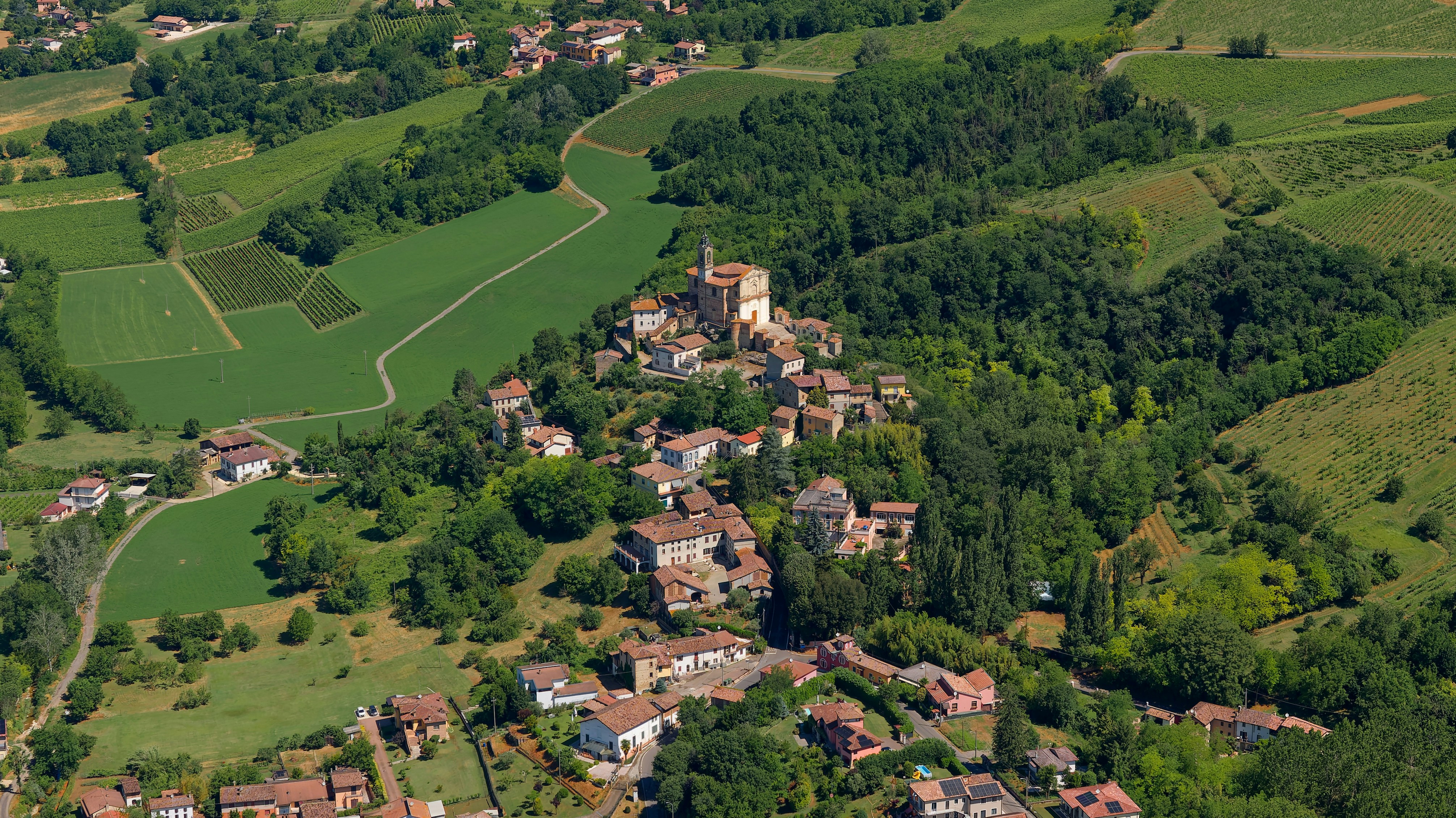 Aerial Village Amid Verdant Patchwork