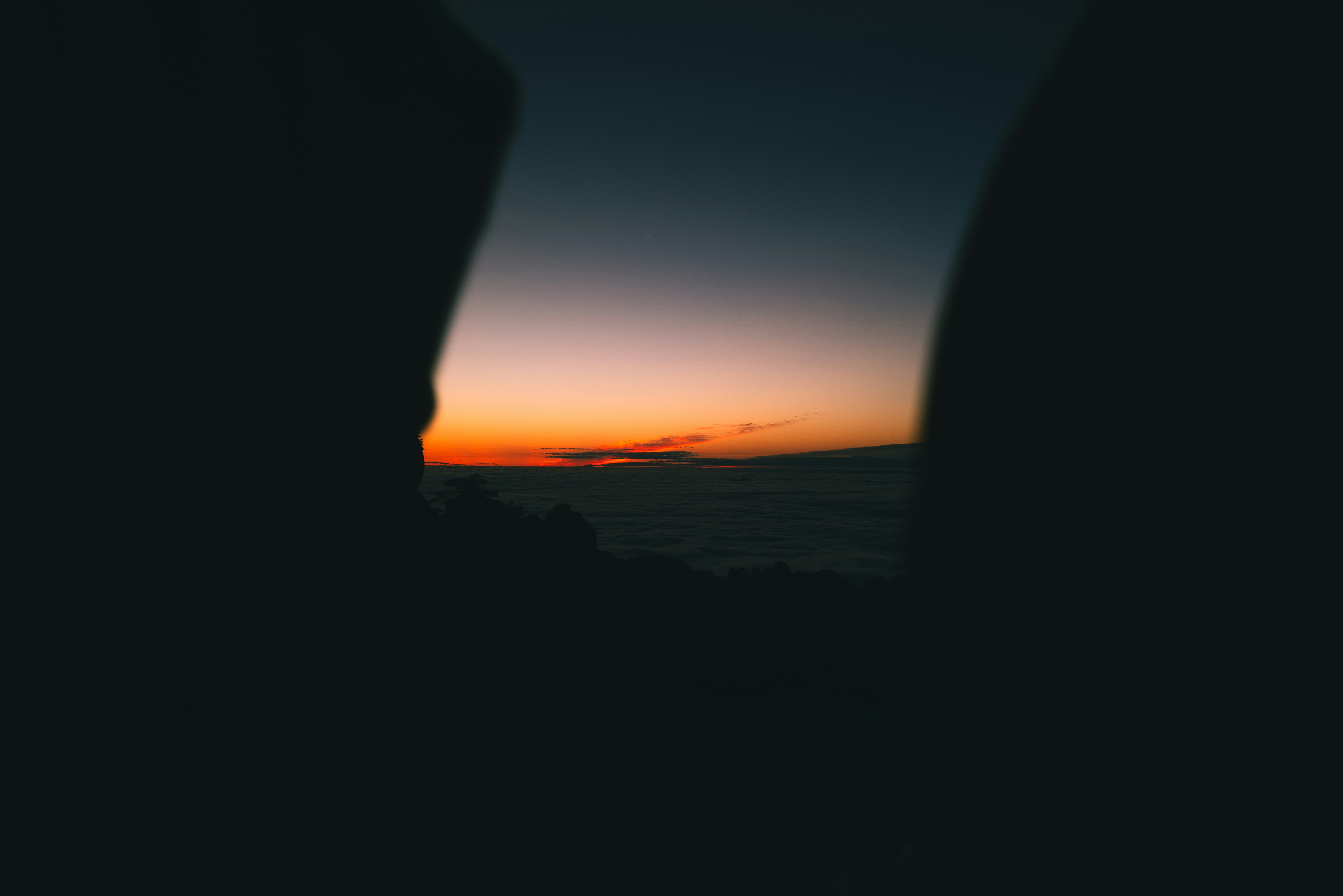 Sunset Gap: A Quiet Horizon Between Shadowed Cliffs