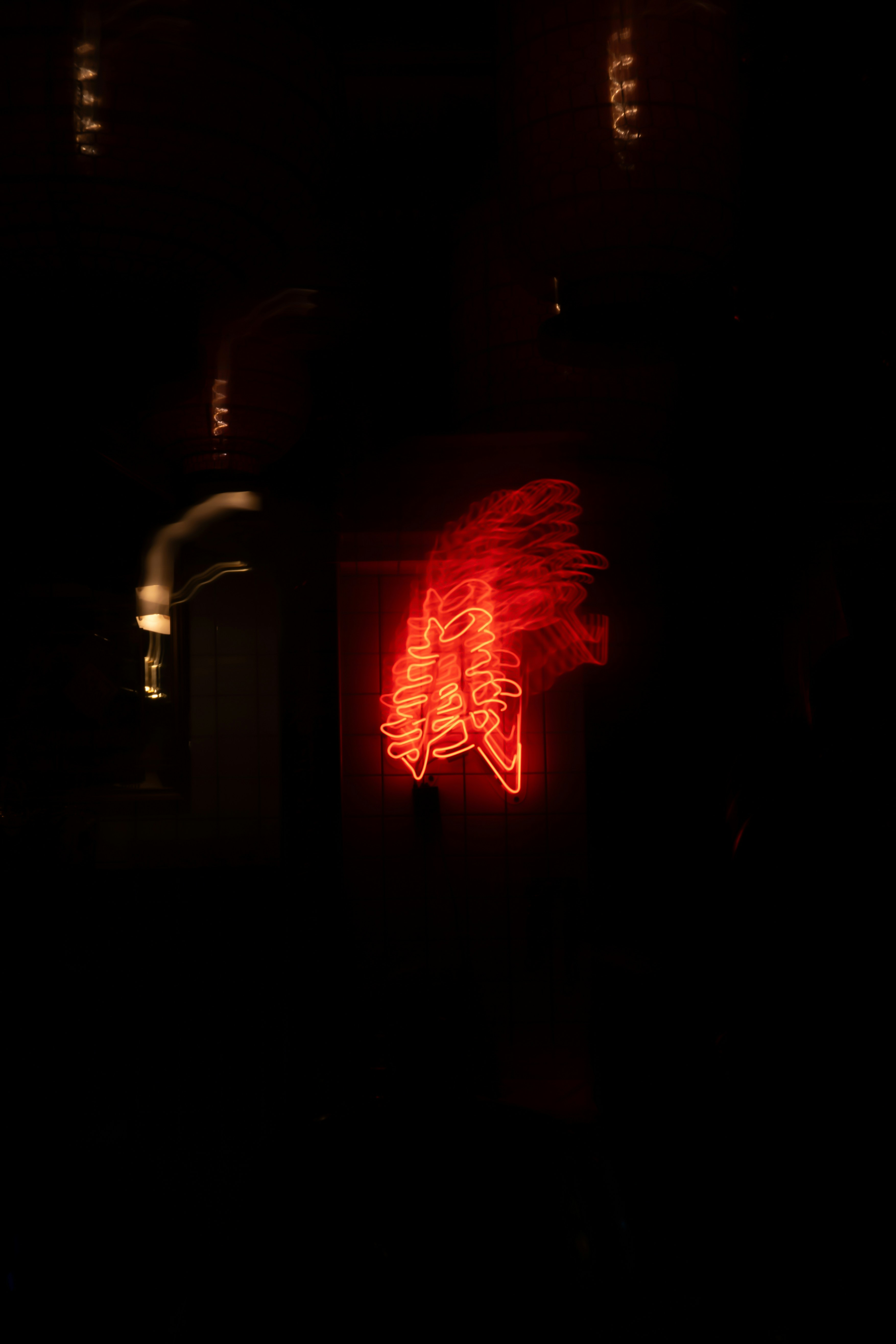 Neon Red Glyph in Dim Loft