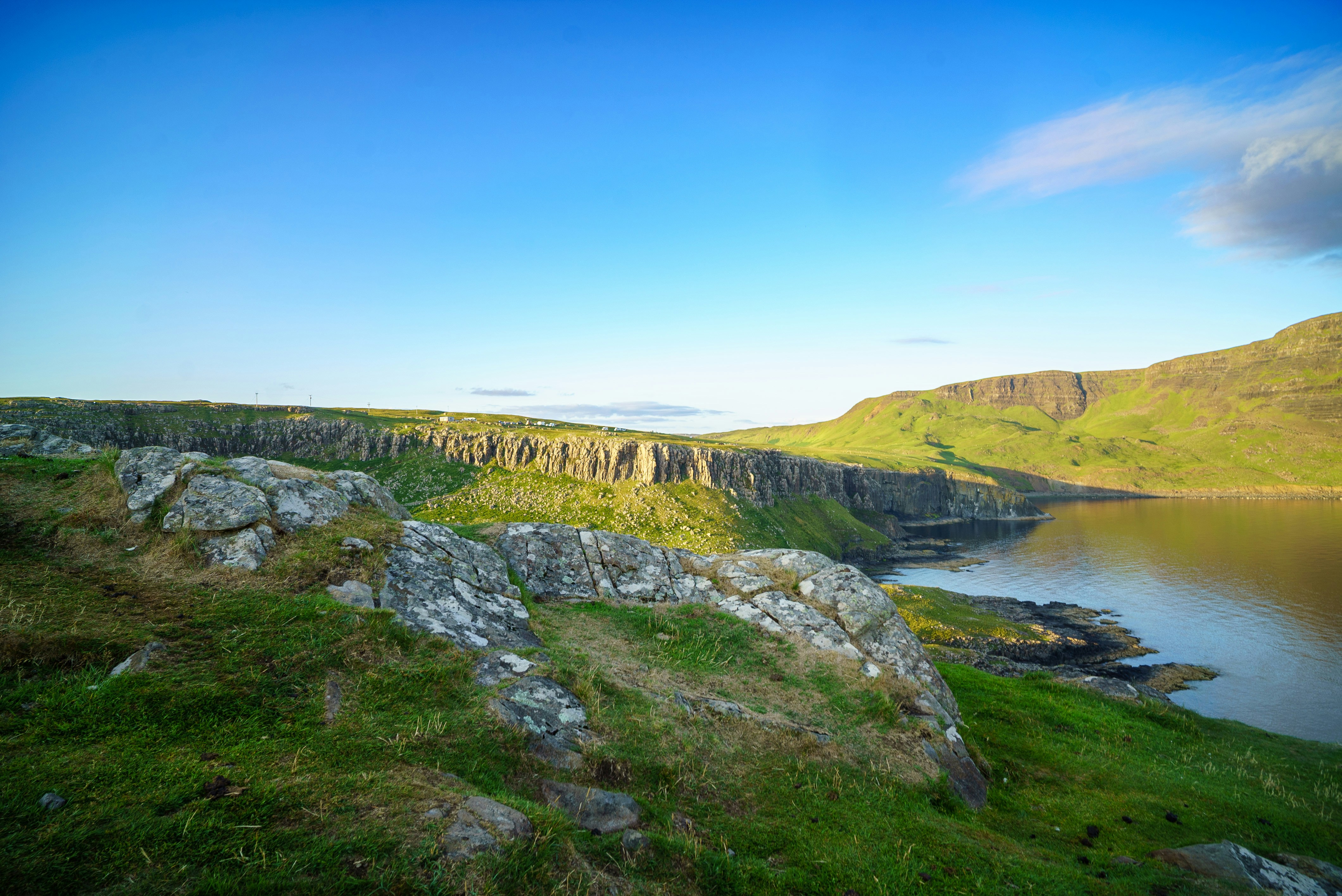 Sunlit Ridge: A Quiet Lip of Rock Overlooking a Serene Shore