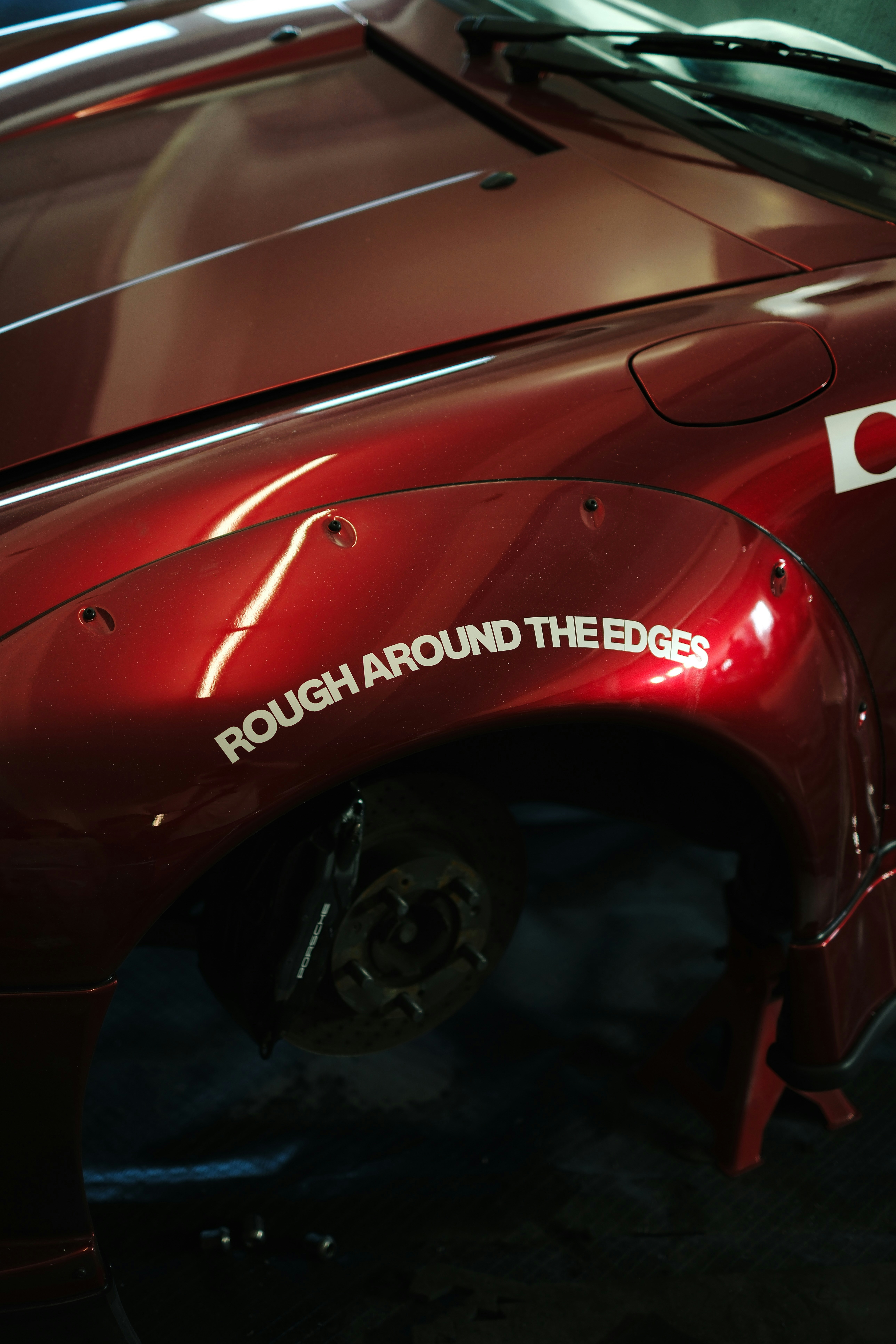 Racing Red: A Curved Fender with Bold Slogan