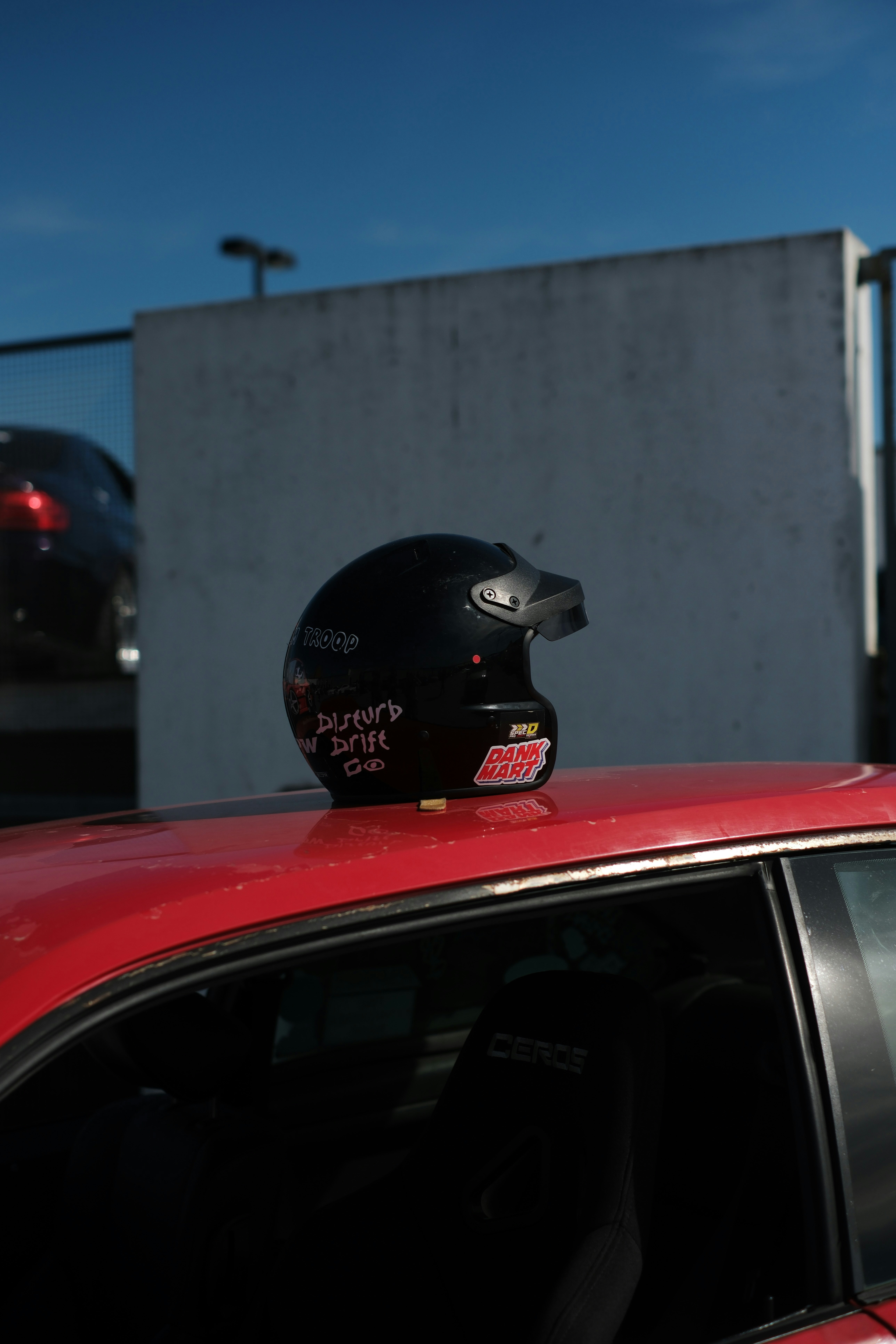 Red Car Helmet at Rest: A Close-Up on a Racing Moment