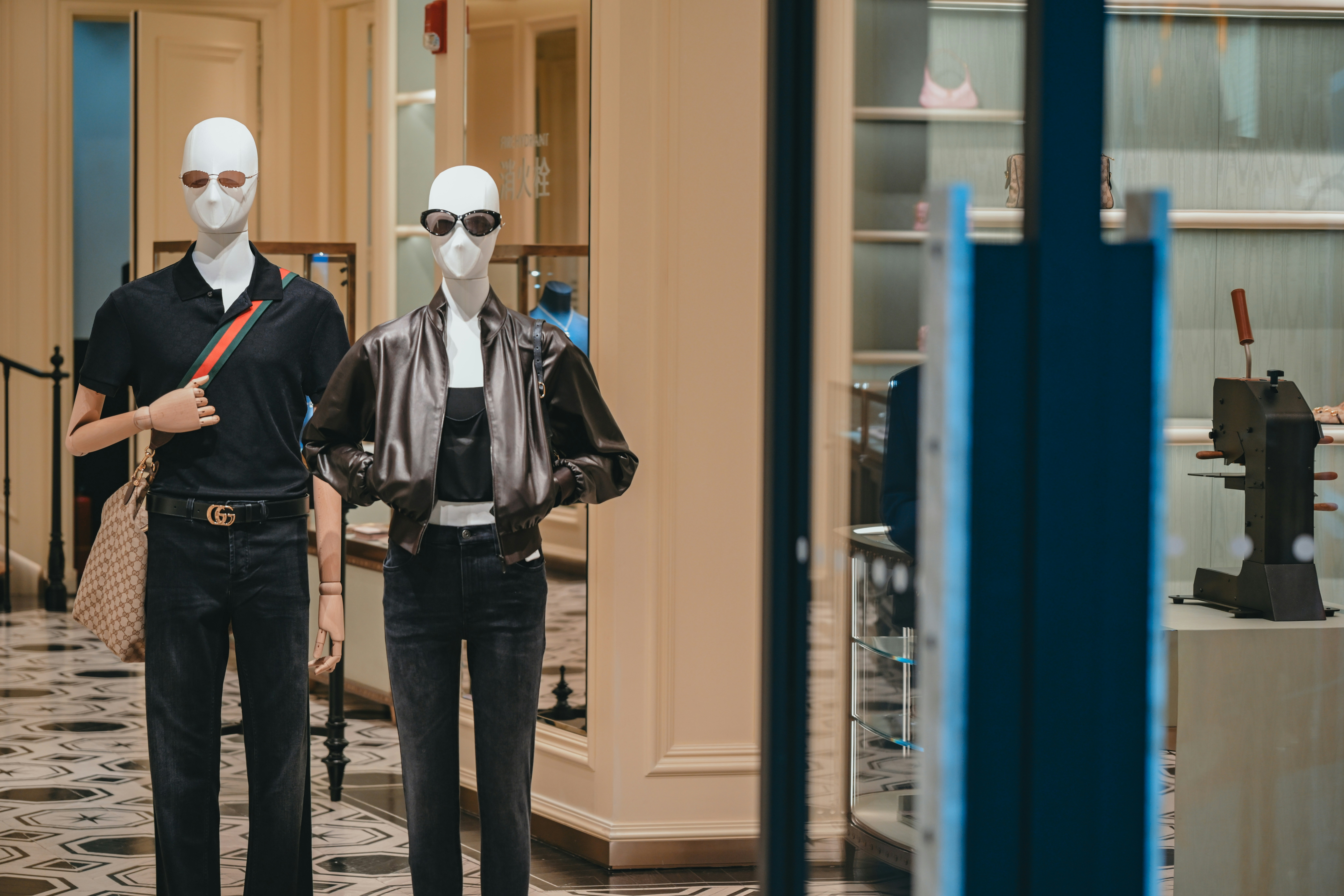 Masked Fashion Duo in a Luxe Corridor