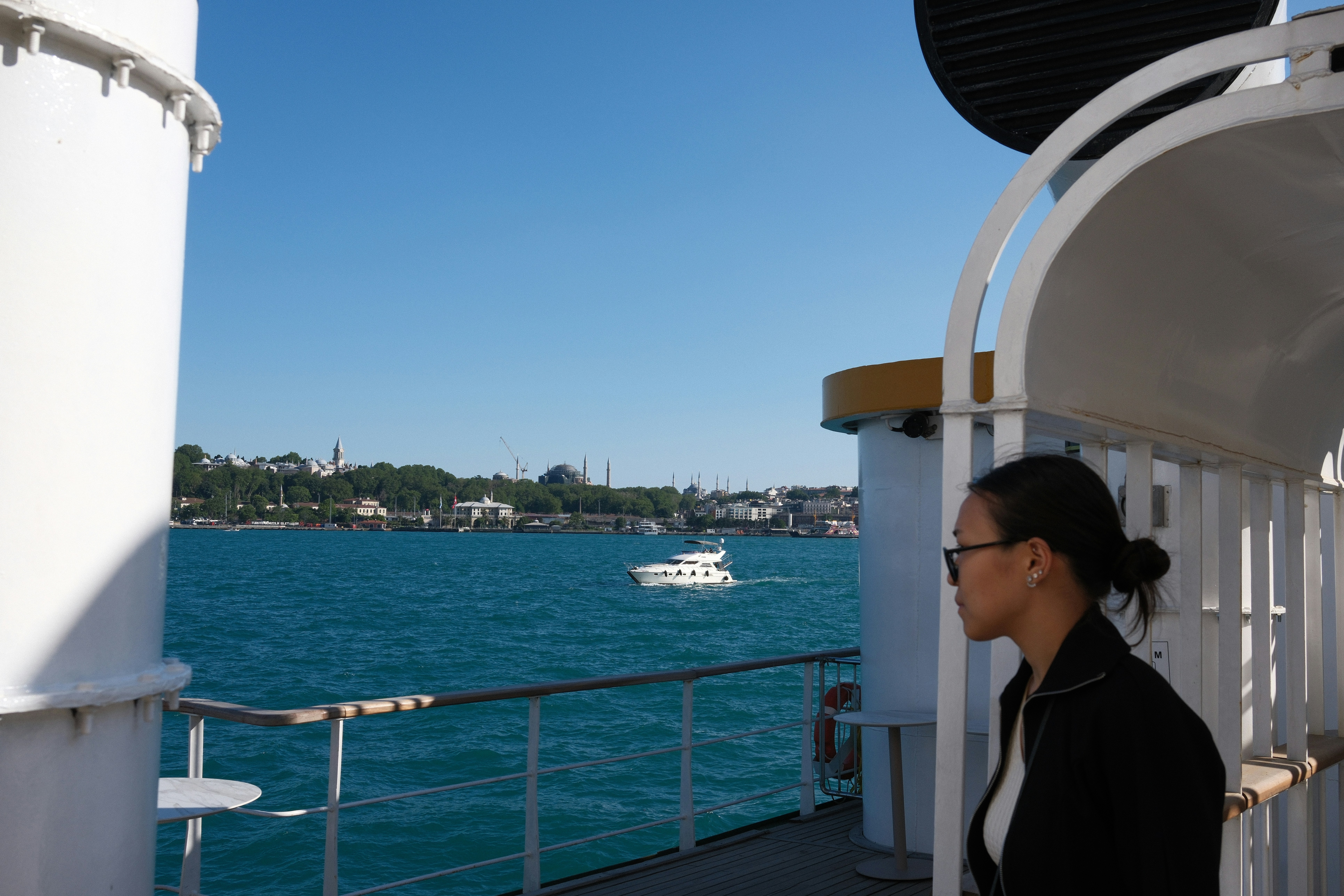 Sidelit silhouette on the waterfront deck