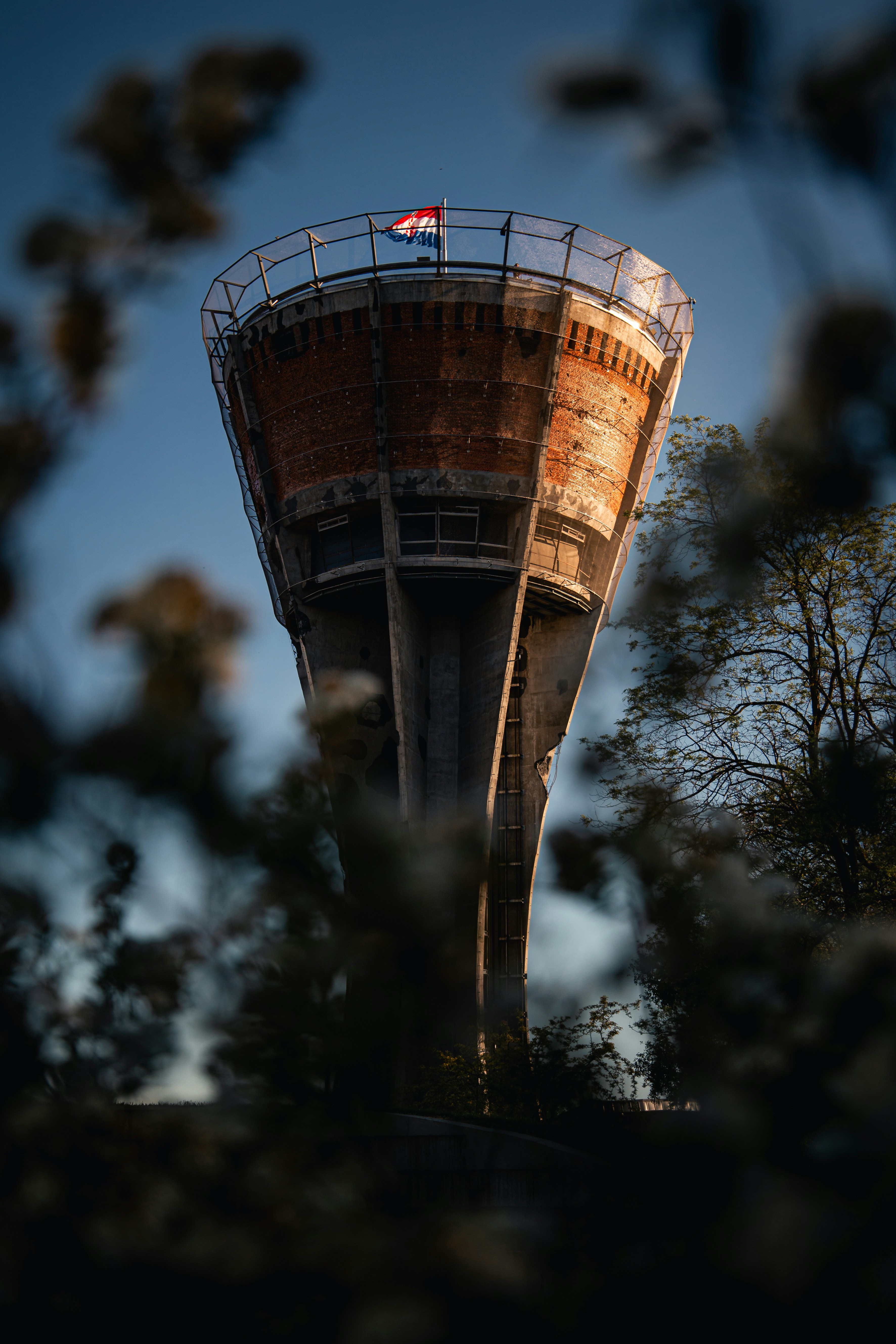 The Watchtower in Focus: A Weathered Sentinel Rises Above Shadows
