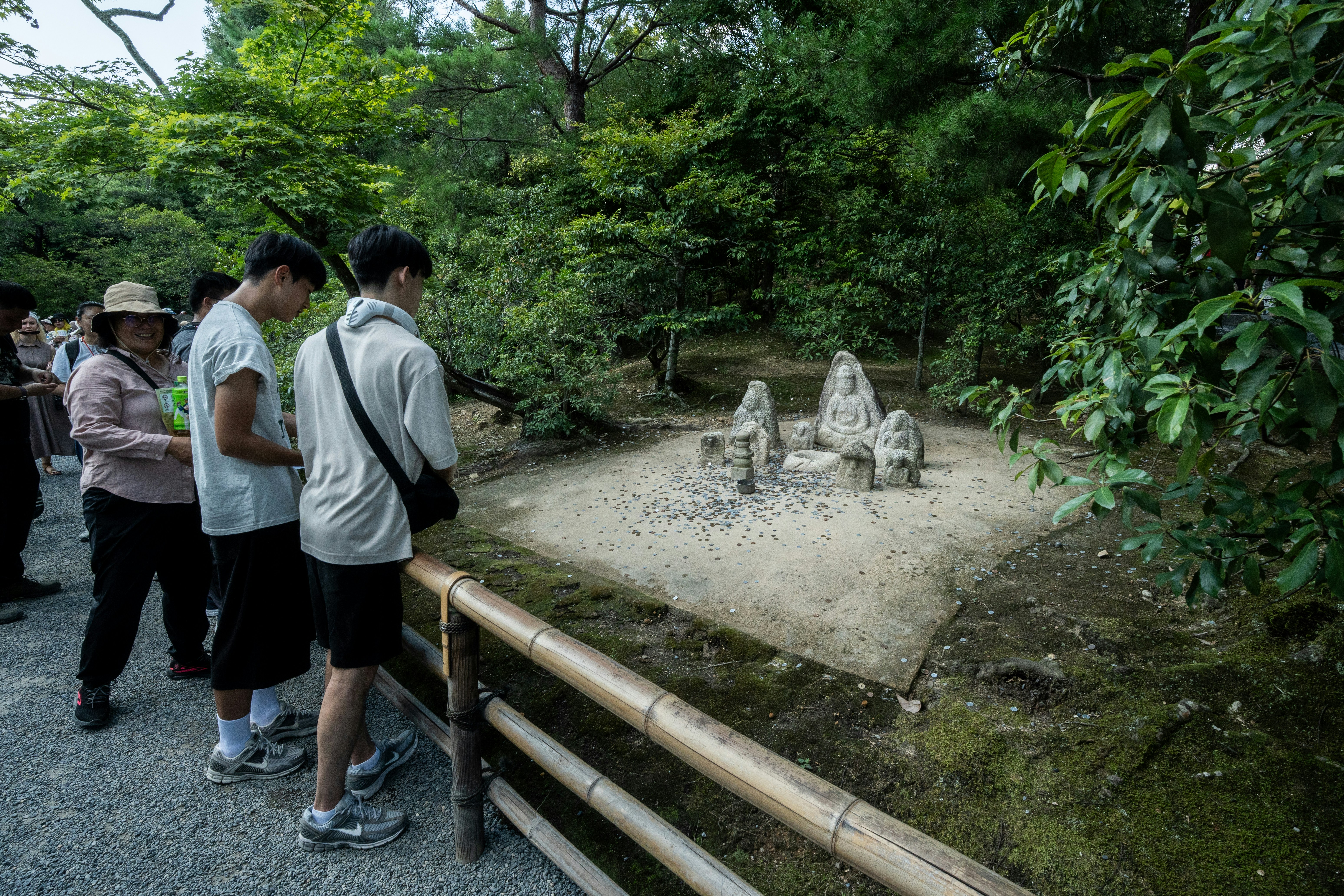 Onlookers Pause at a Quiet Zen Garden Scene