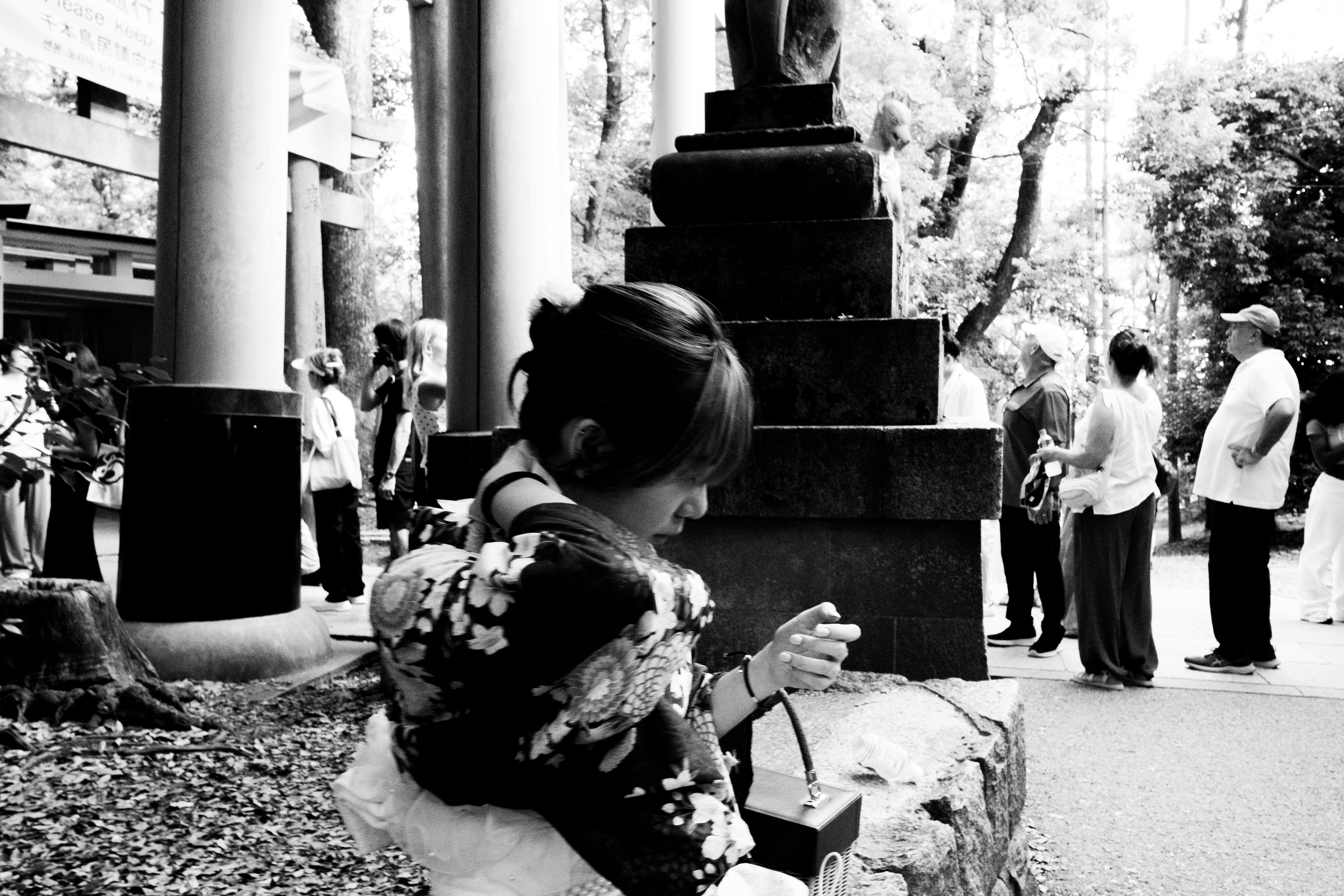 A young woman in a kimono at a japanese temple.