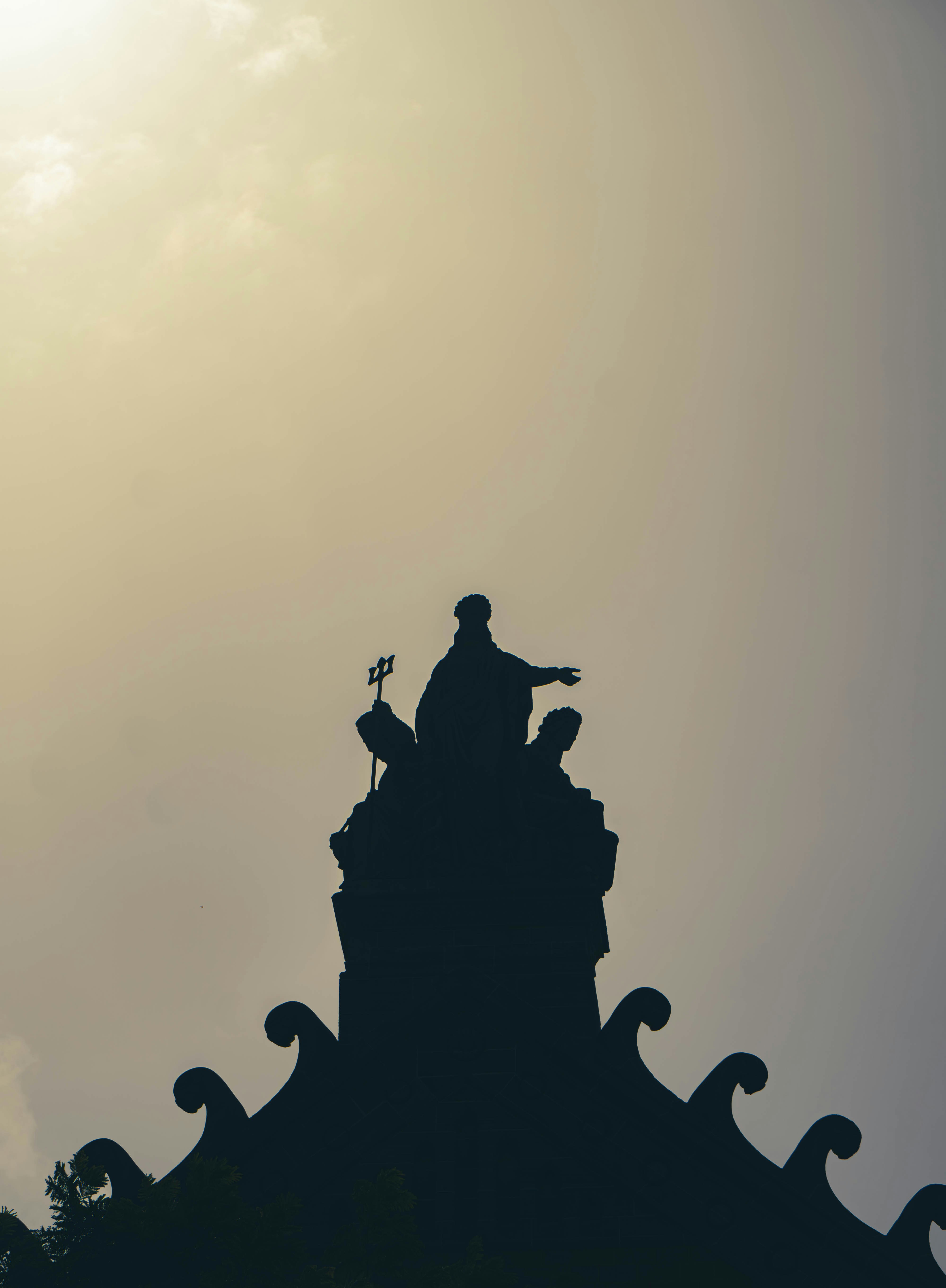 Silhouette at the Peak: Monumental Crest Against a Sunlit Sky
