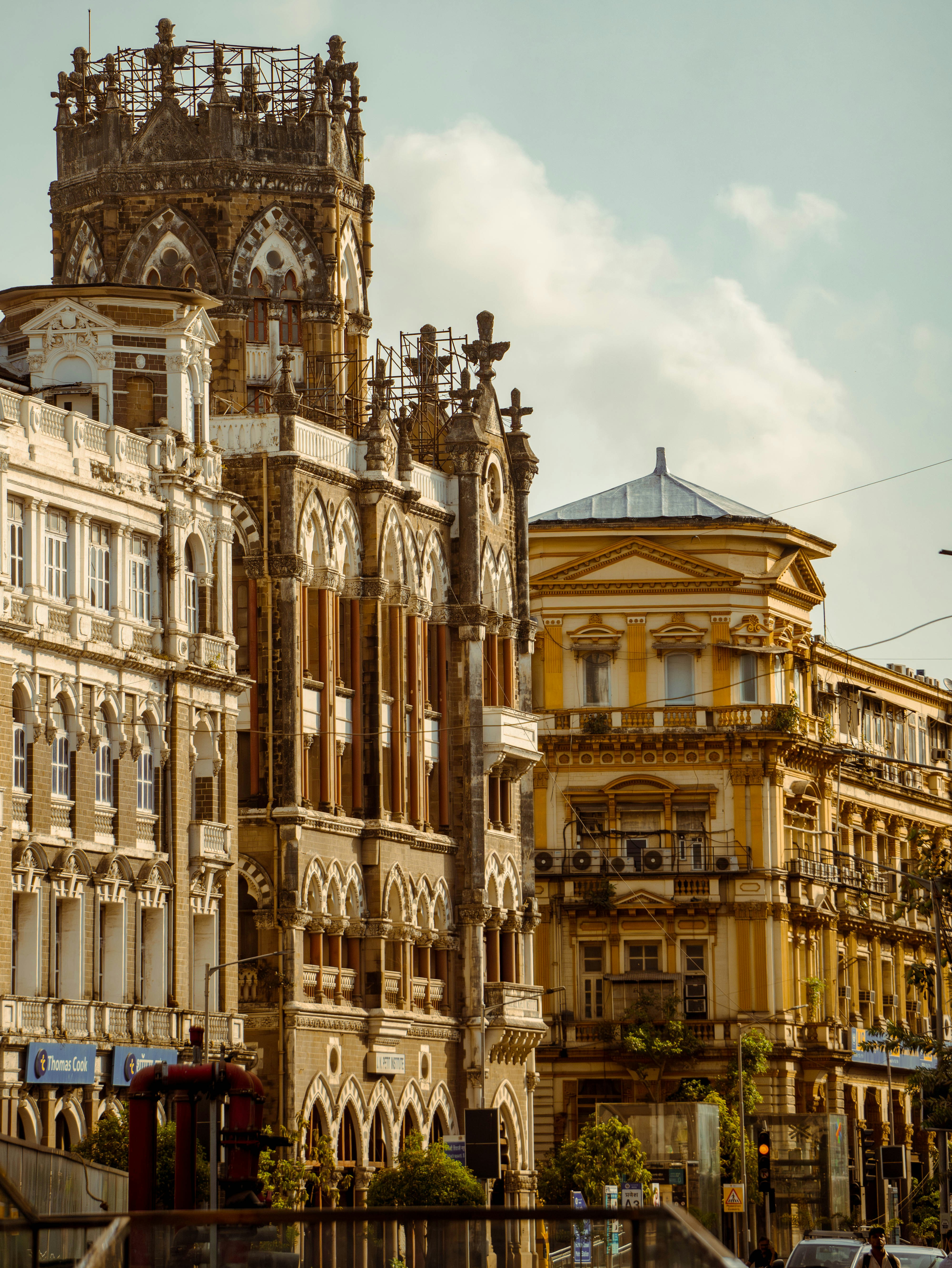 Granite Gothic and Sunlit Facades: A Street Vista in Warm Light