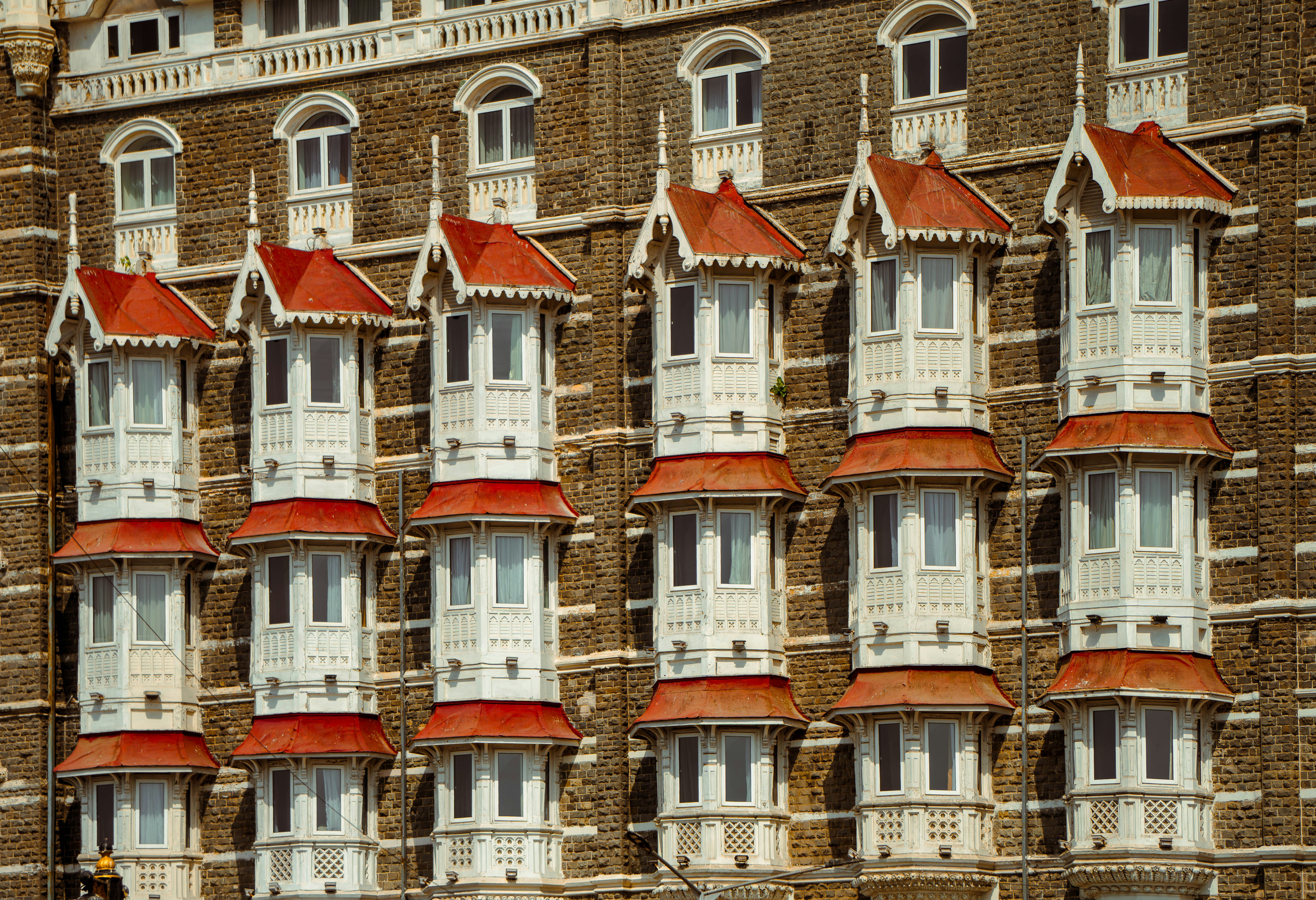 Red-Windowed Victorian Rows: Repetition and Red-Topped Facades