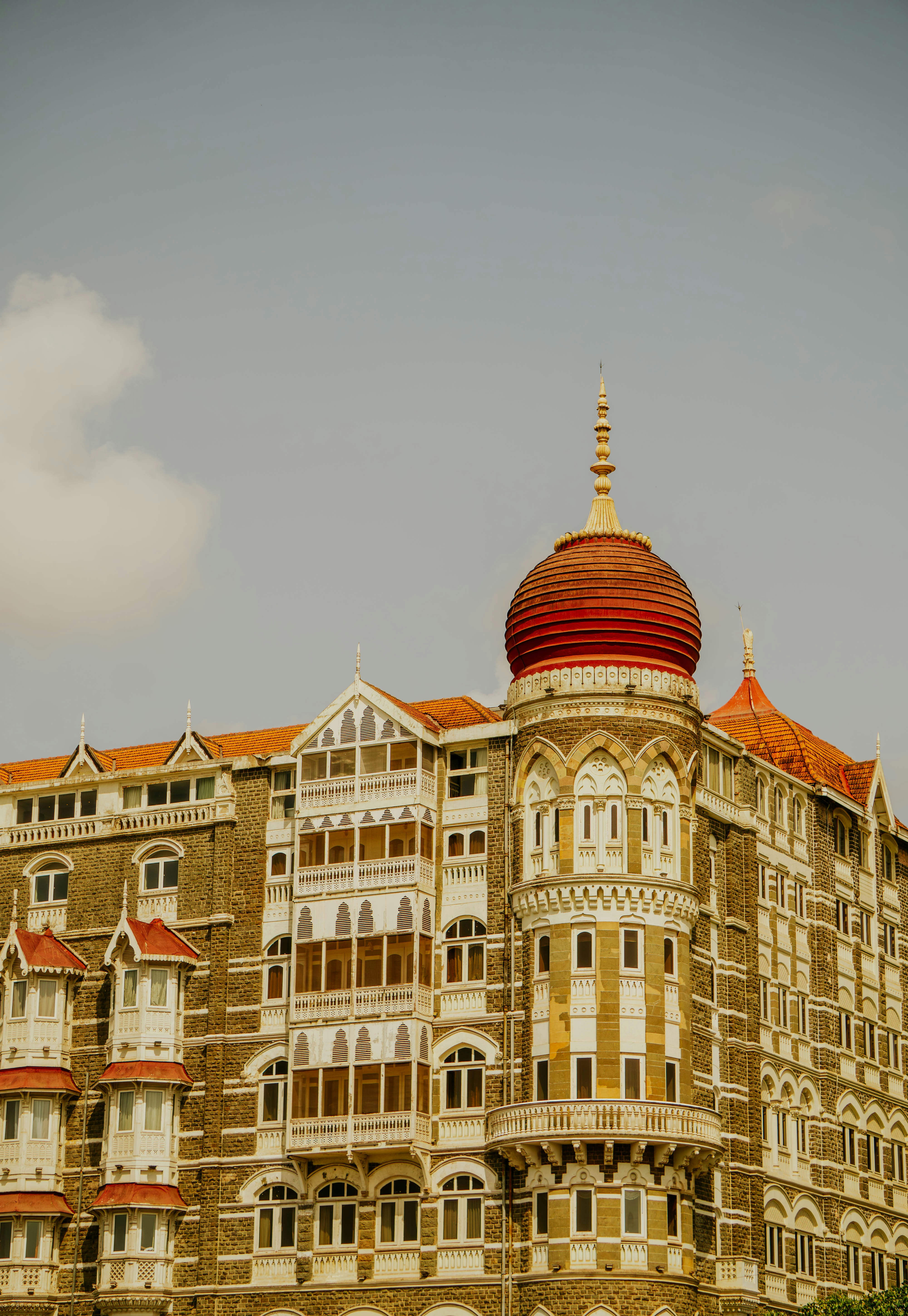Empire of Tiles: A Coral Dome Crowned on a Victorian Facade