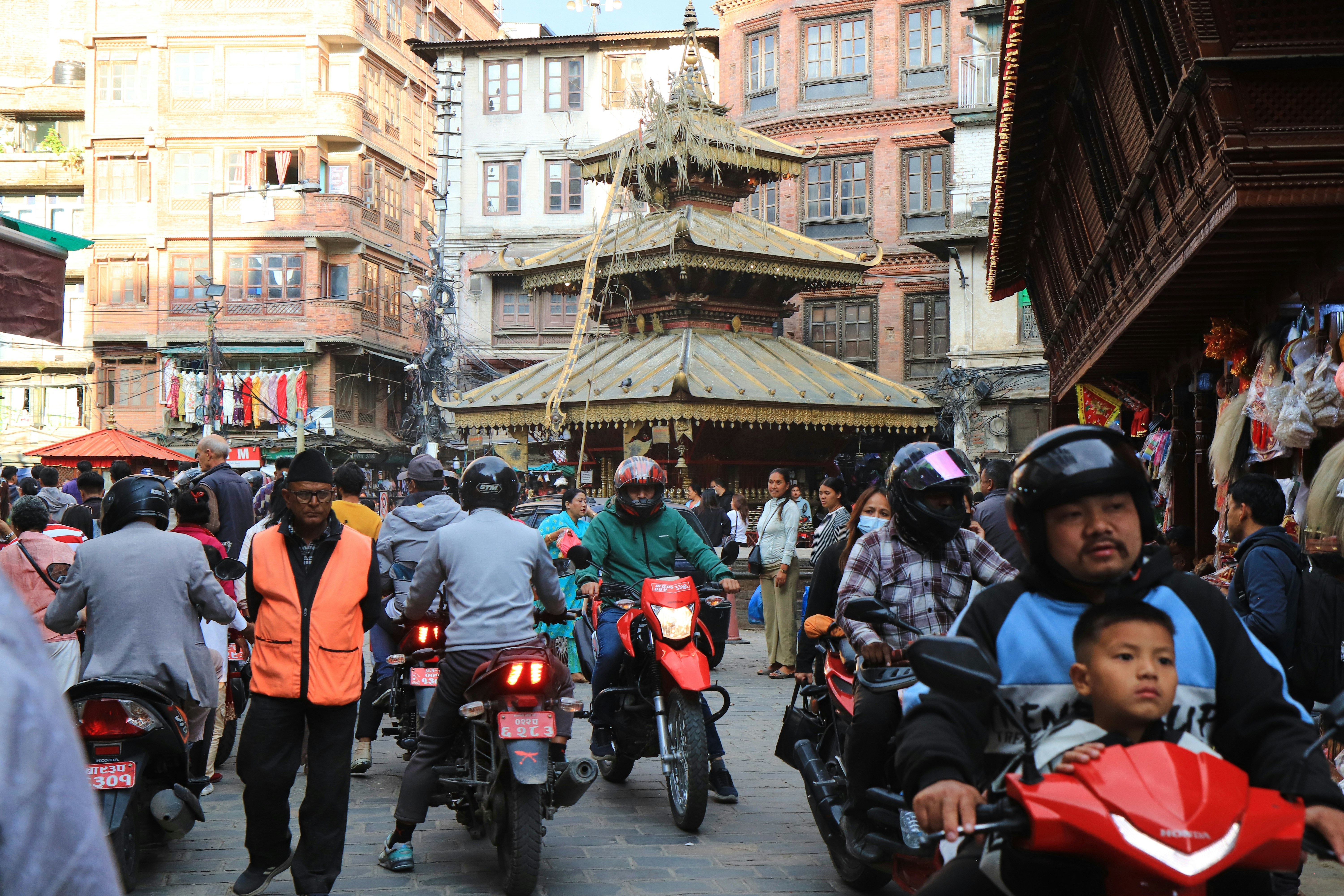 City Square Collision: Motorbikes and Pedestrians in a Nepalese Market