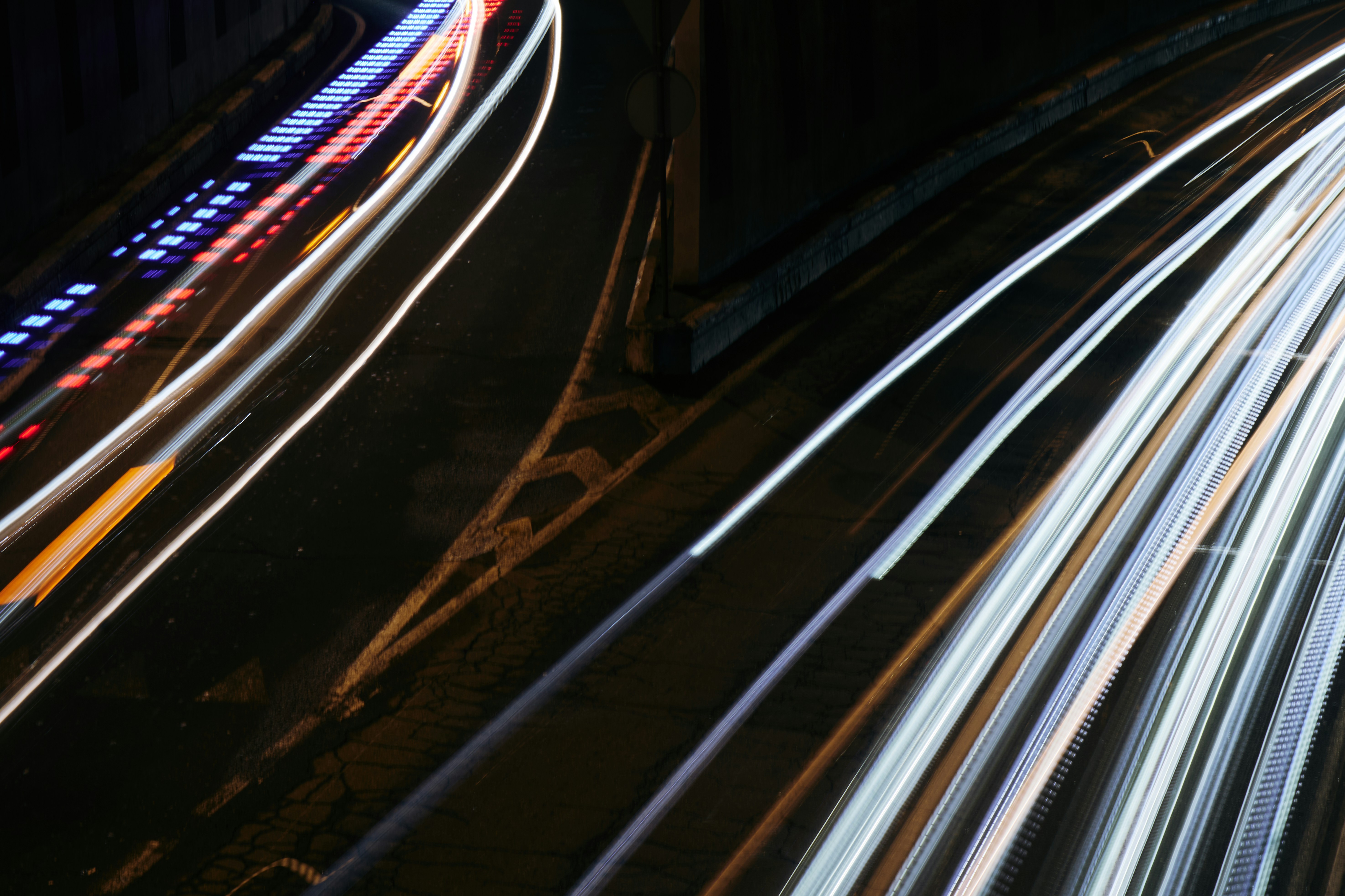 Taillights and Light Trails Over a Quiet Urban Street