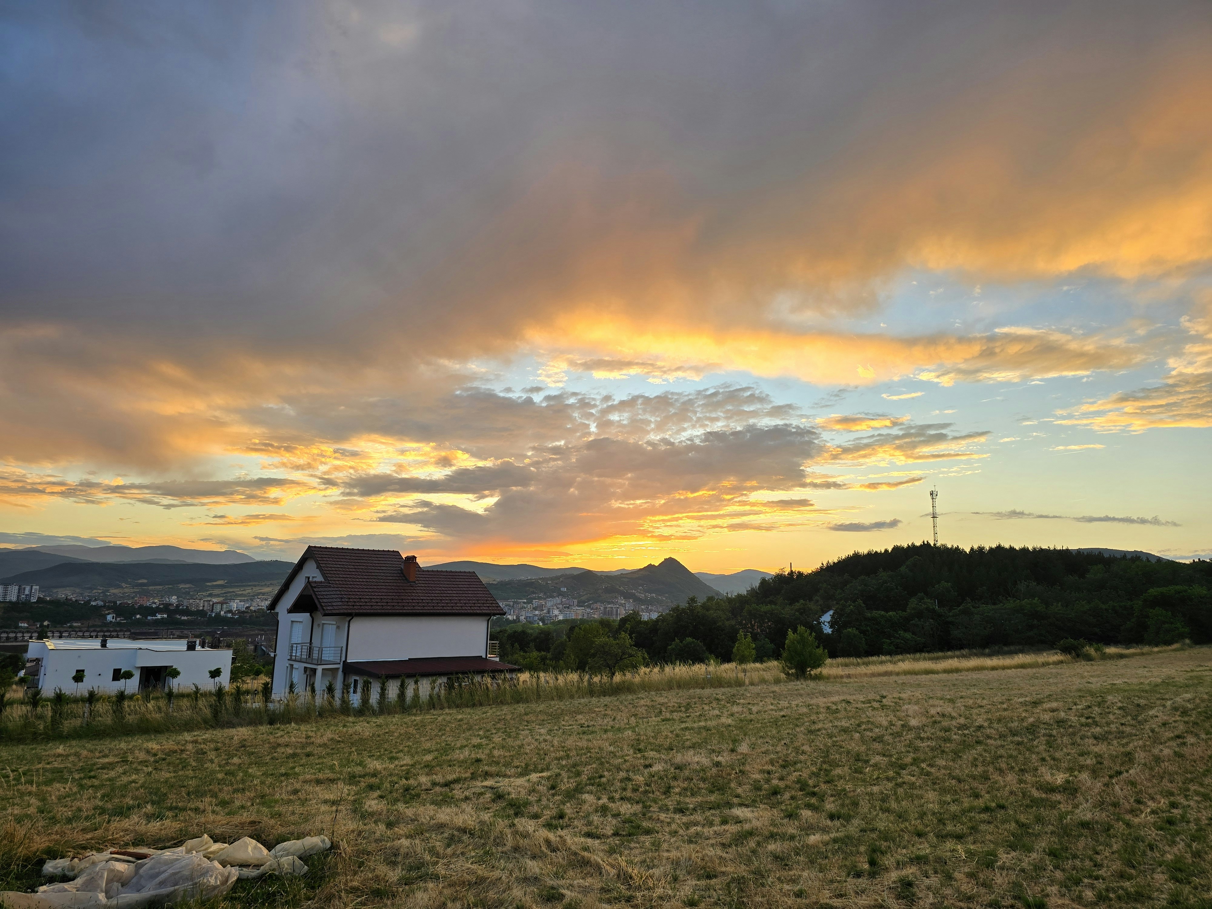 Sunlit Horizon Over a Quiet Farmstead