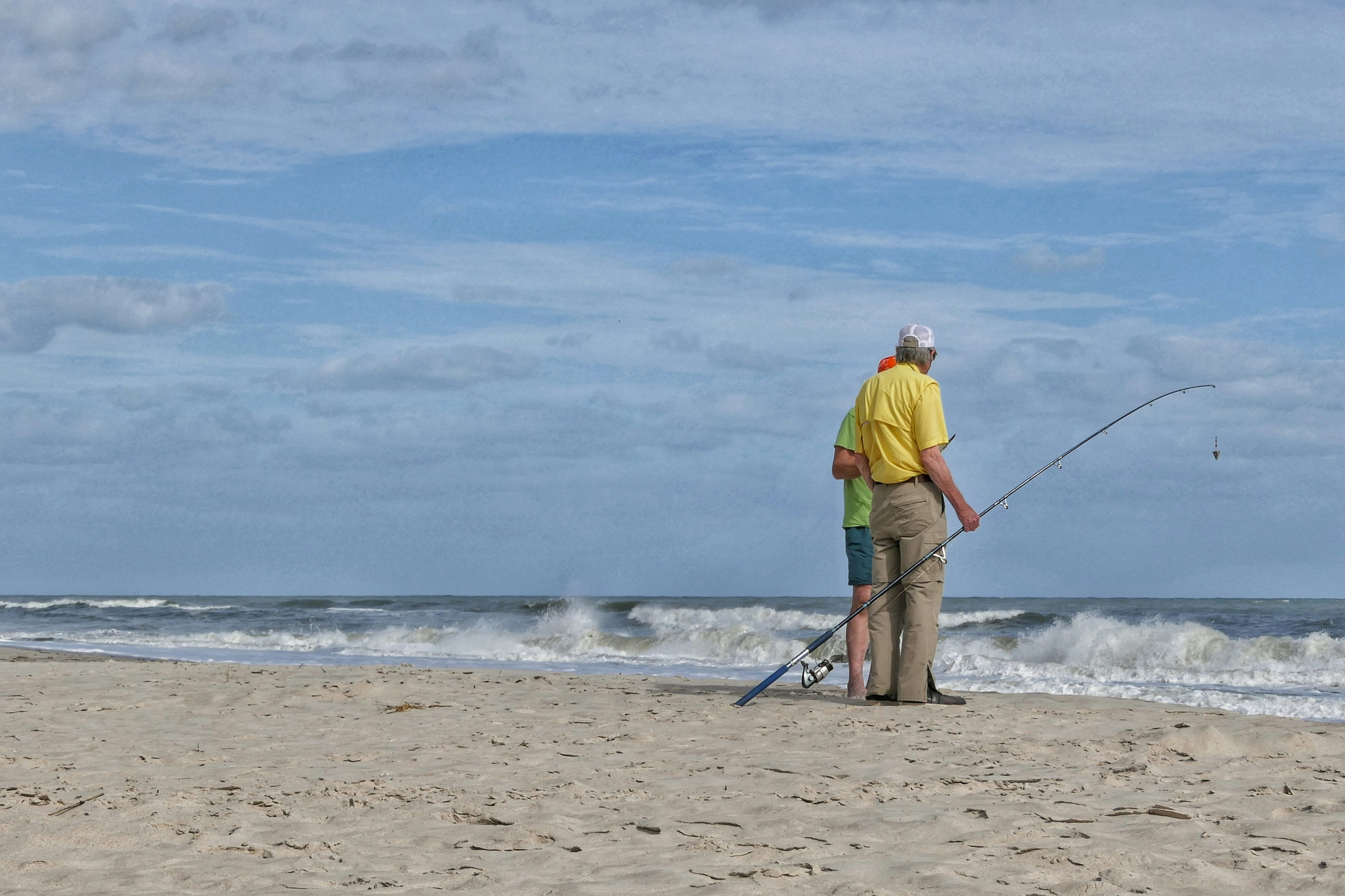 Two Anglers on a Quiet Beach: Waiting for a Bite
