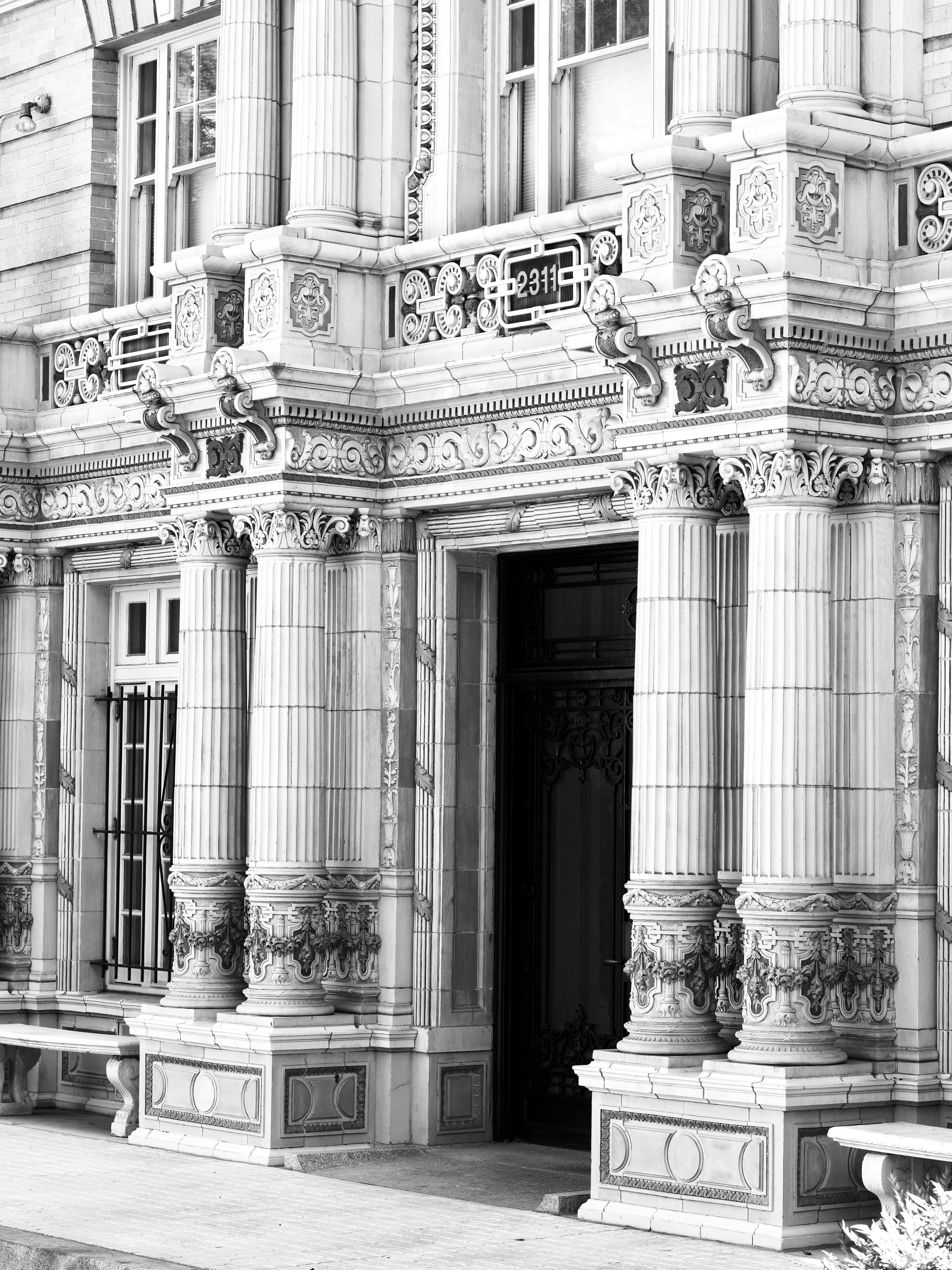 Ornate Facade Portal: Carved Columns and Intricate Stonework