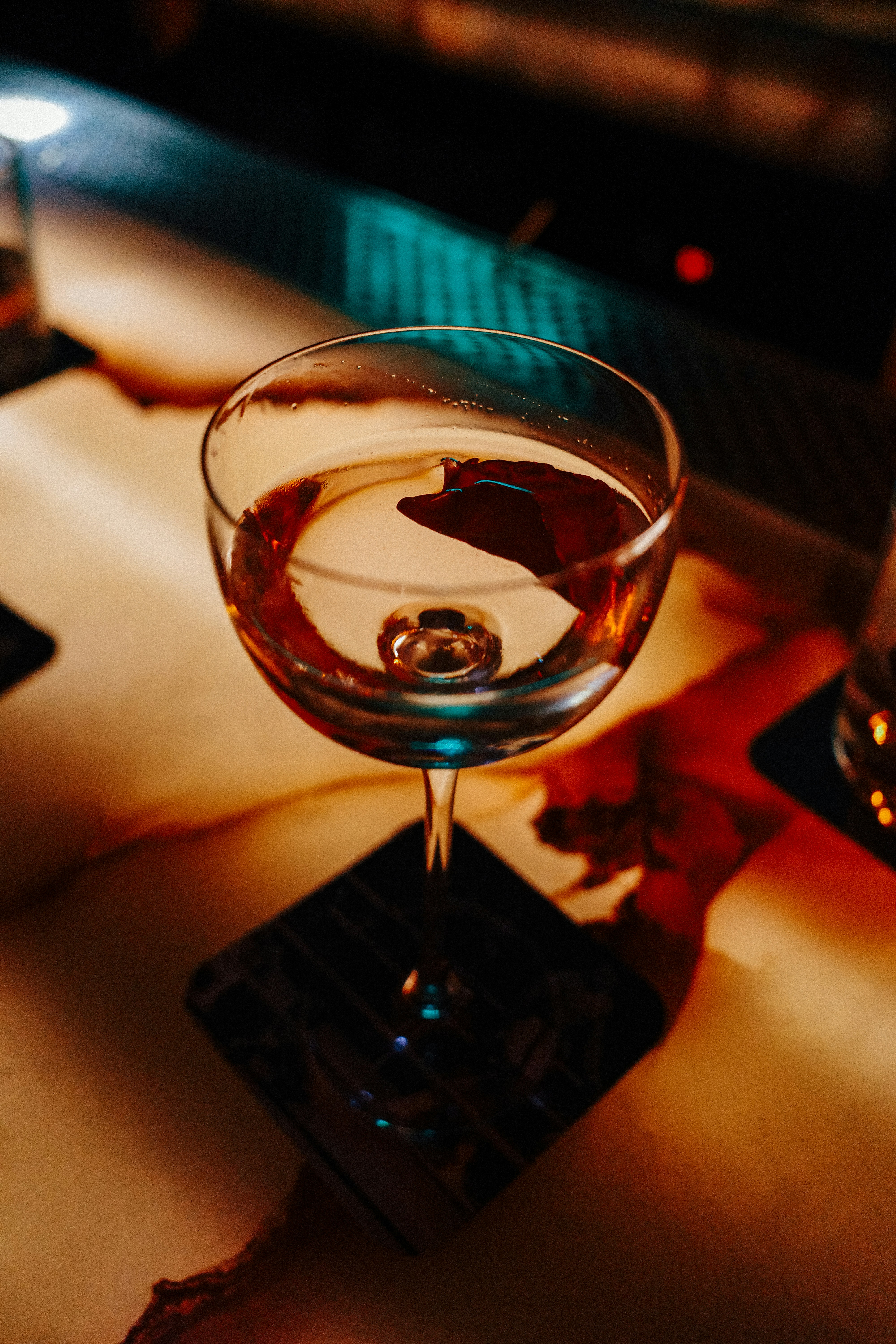 Amberglow Sip: A refined cocktail in a rounded glass