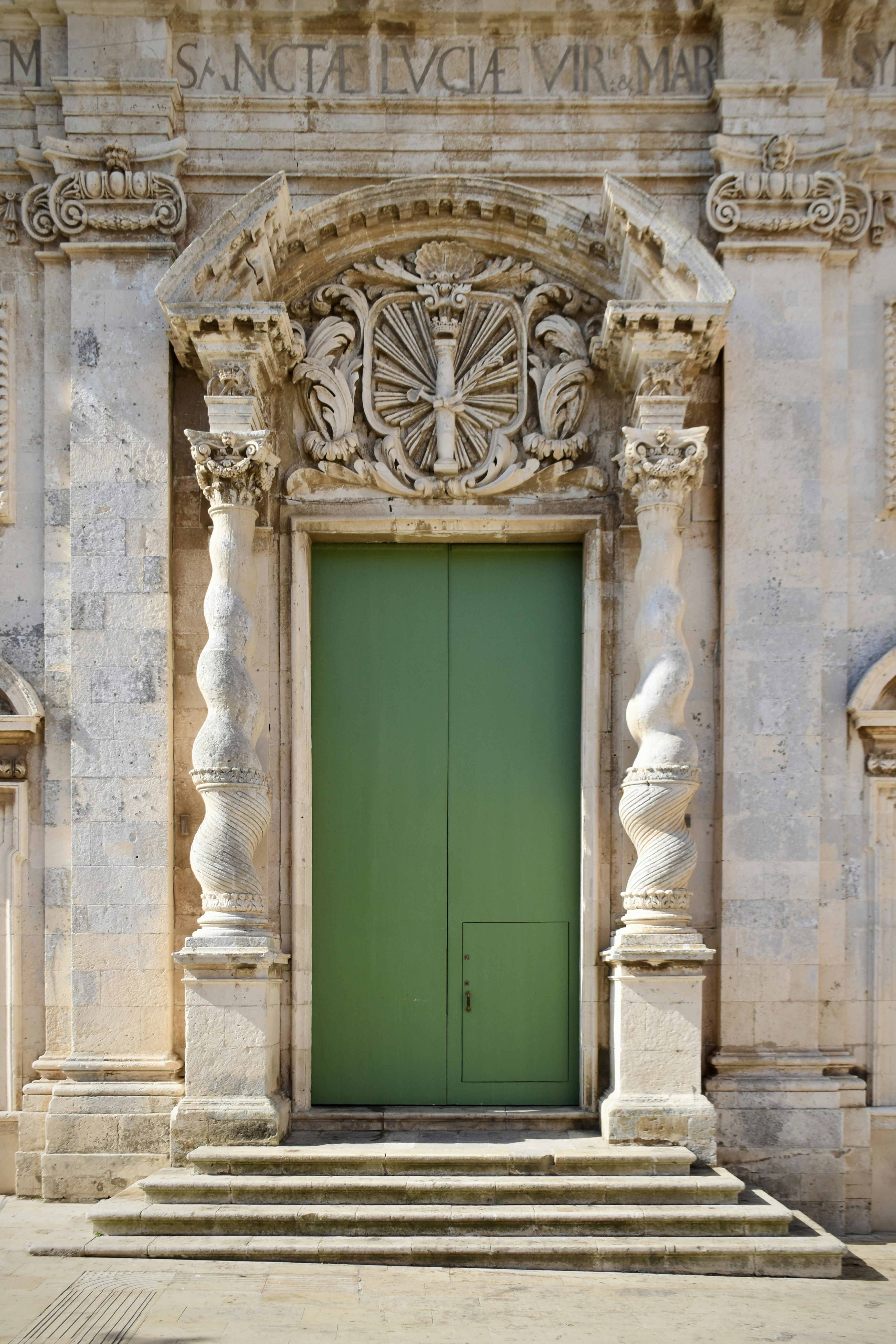 Emerald Doorway: A Stone Portal Framed by Sculpted Twists
