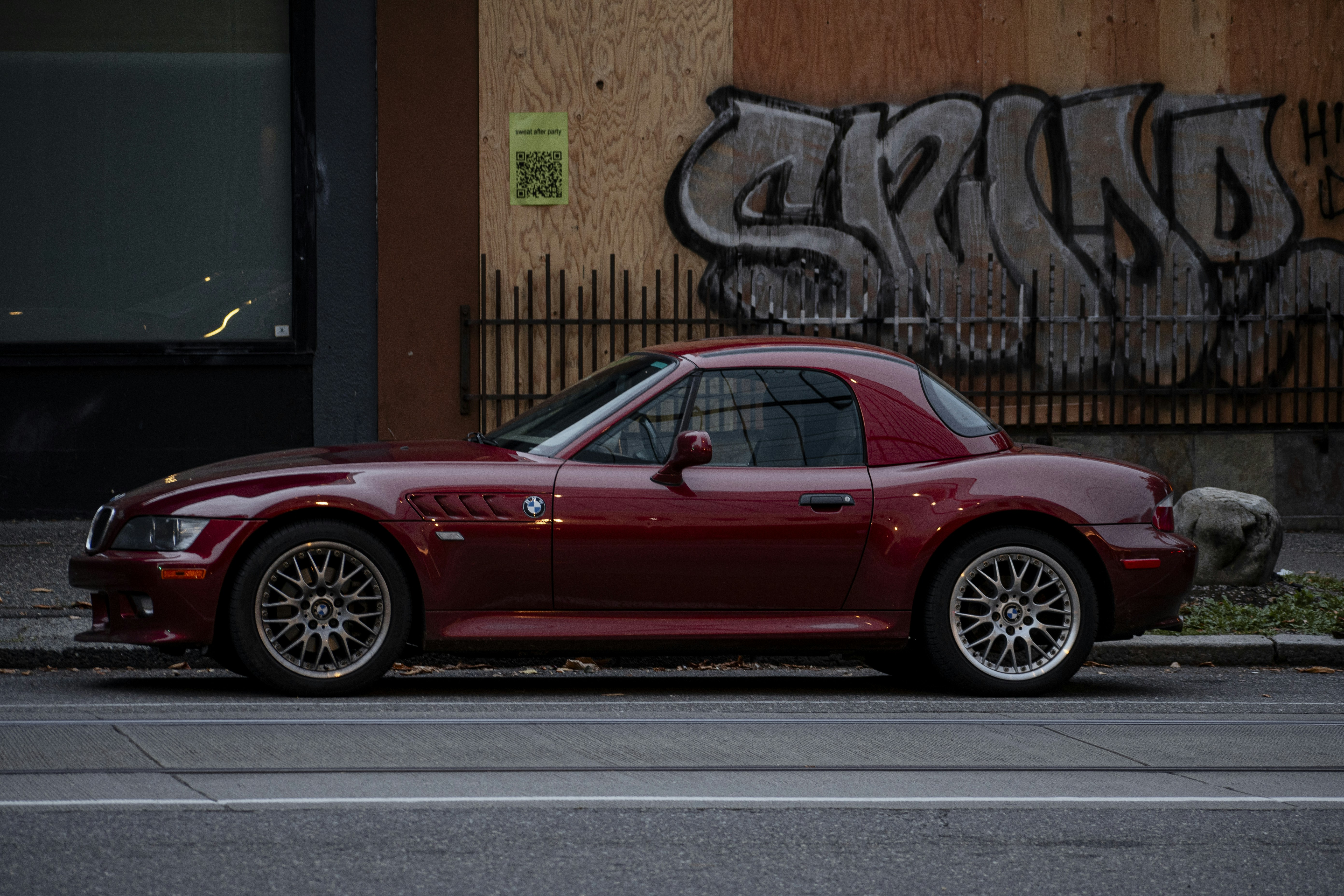 Red Roadster on a Graffiti-Streaked Street