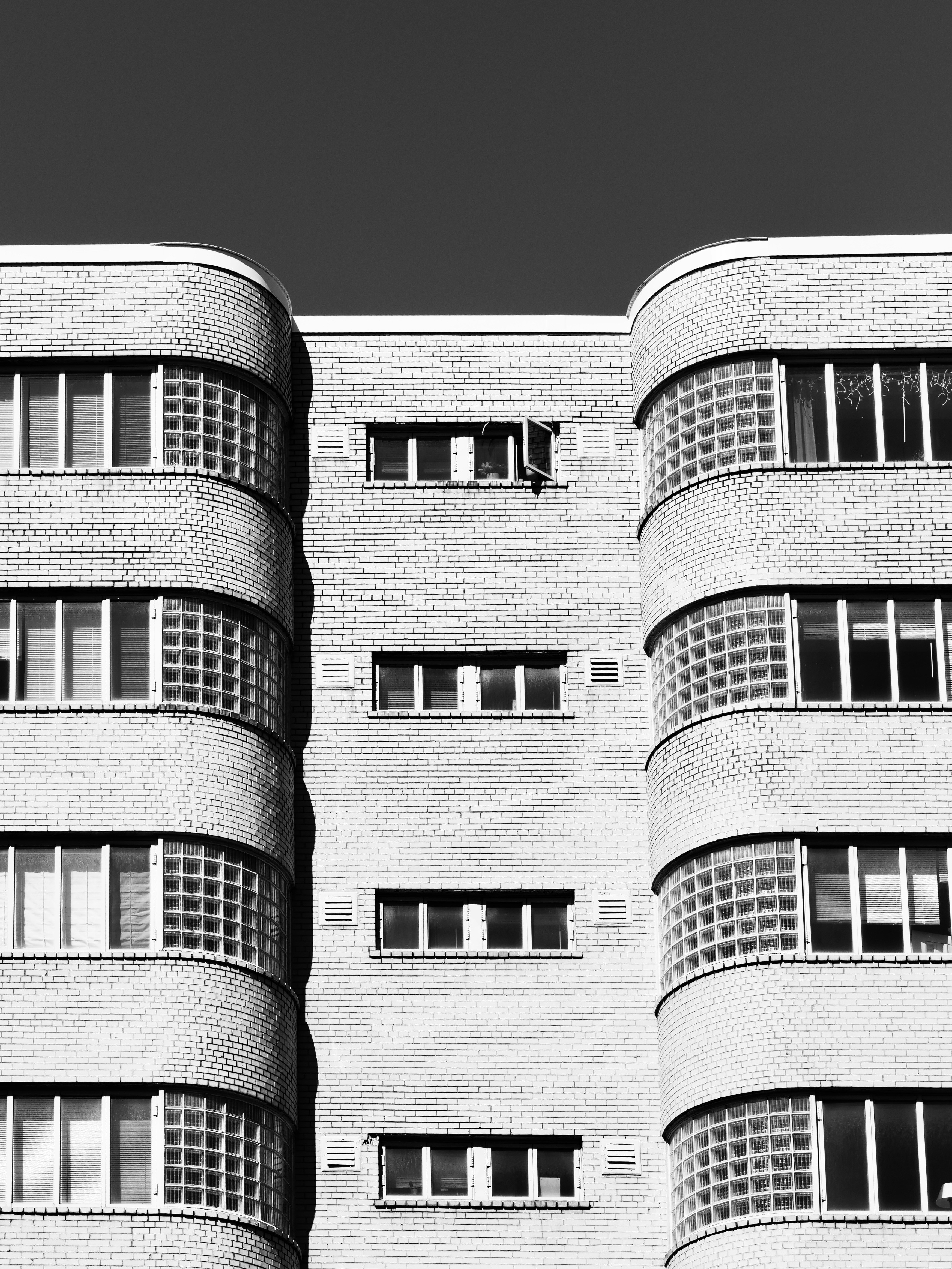 Symmetric Brick Towers Framing a Central Corridor