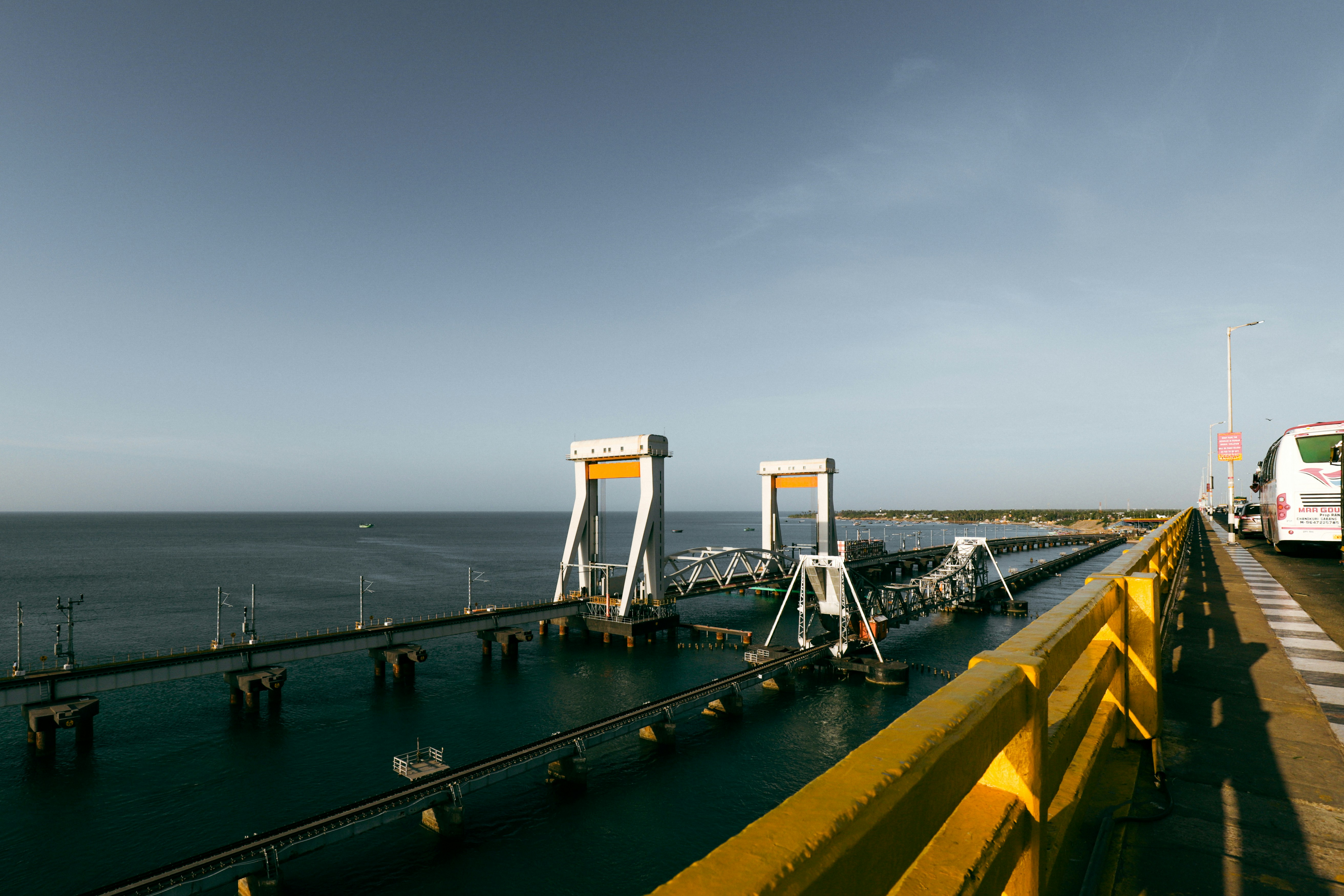 Harbor Corridor: Yellow Railings and Floating Dock at Distant Horizon