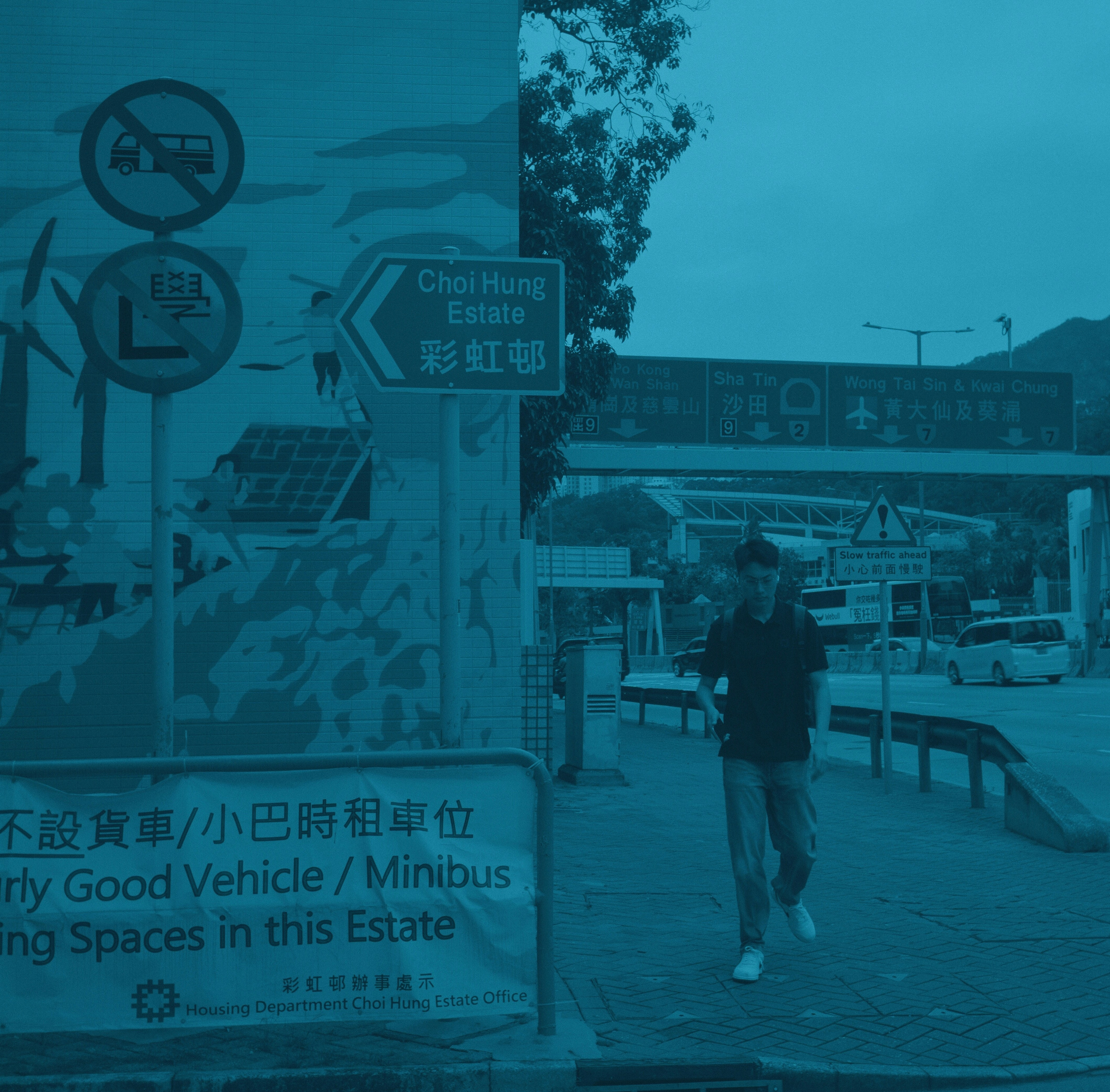 Blue-Tinted Street Scene with a Jogger by Signage Corridor