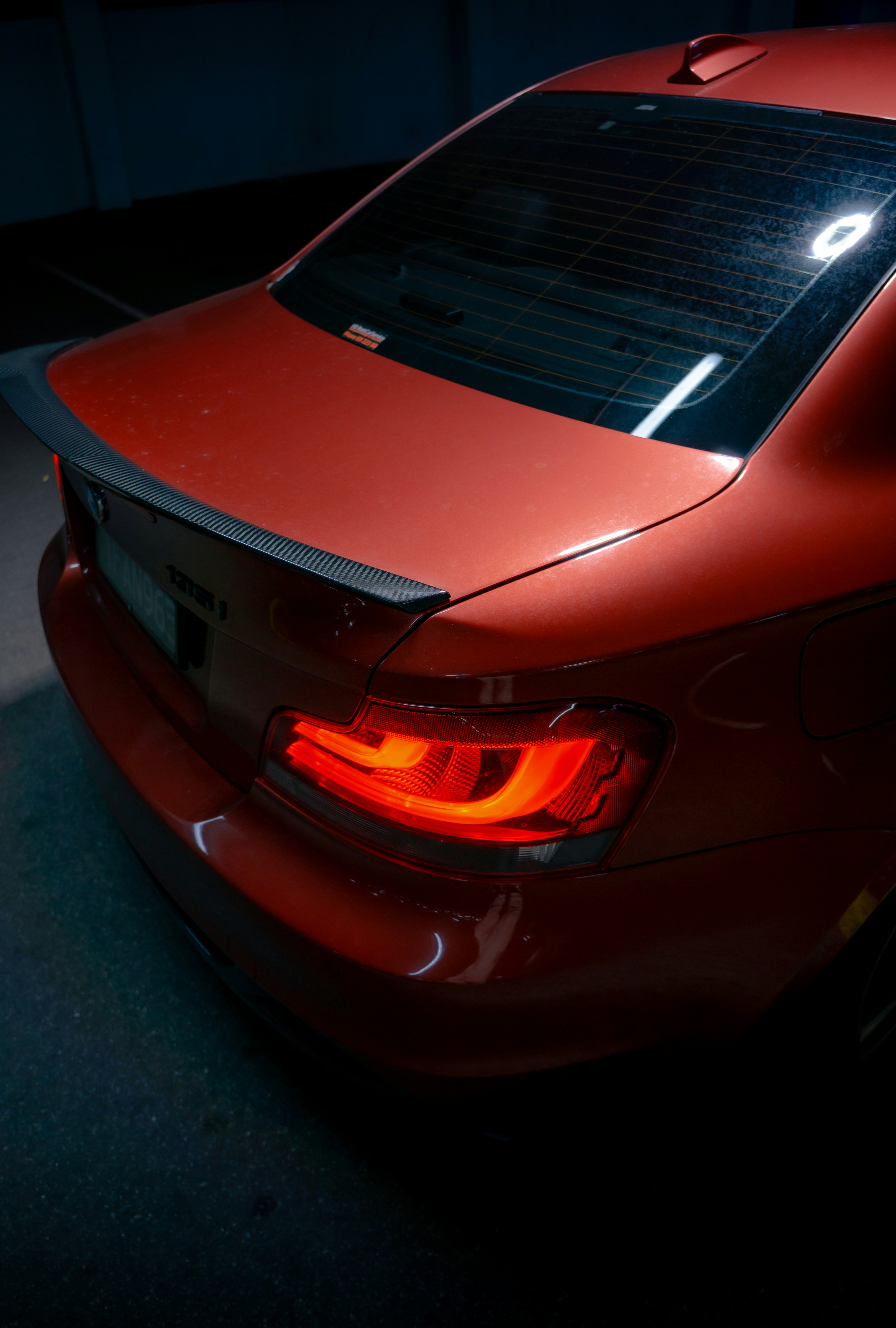 Crimson Reserve: Night-backlit Car in a Quiet Parking Lot
