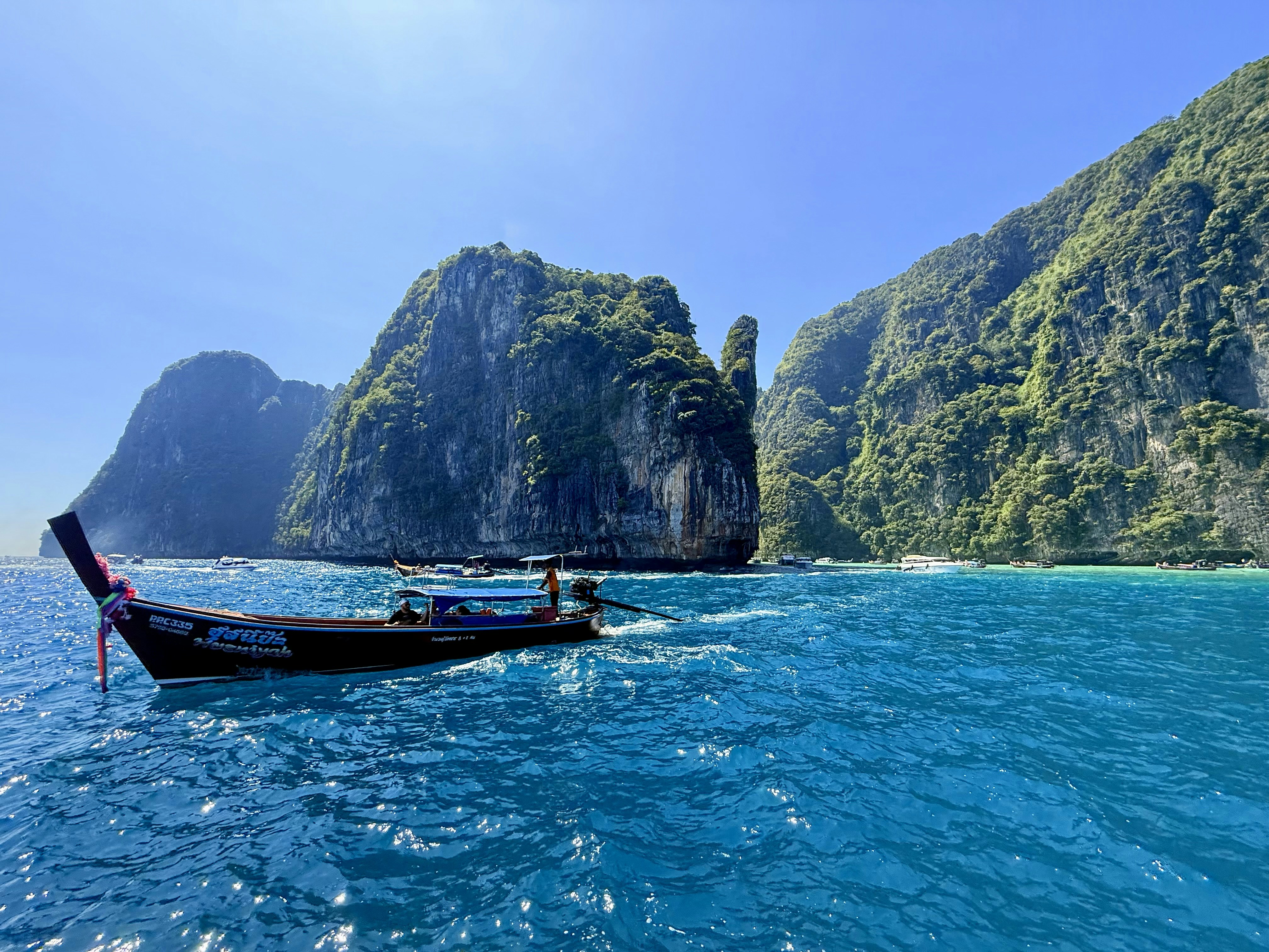 Sapphire Sea and Limestone sentinels from a lone boat