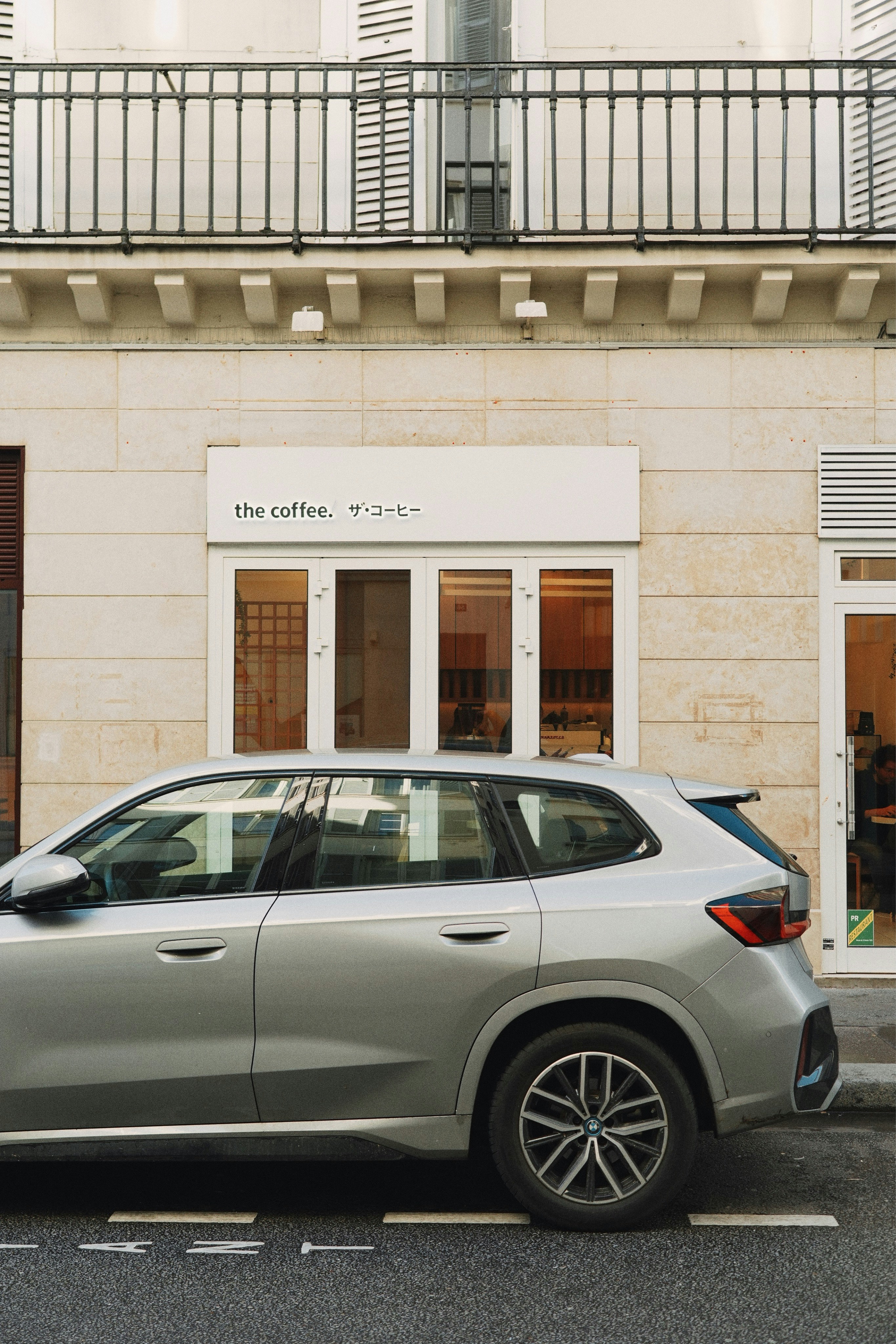 Grey SUV at a Parisian Coffee Shop