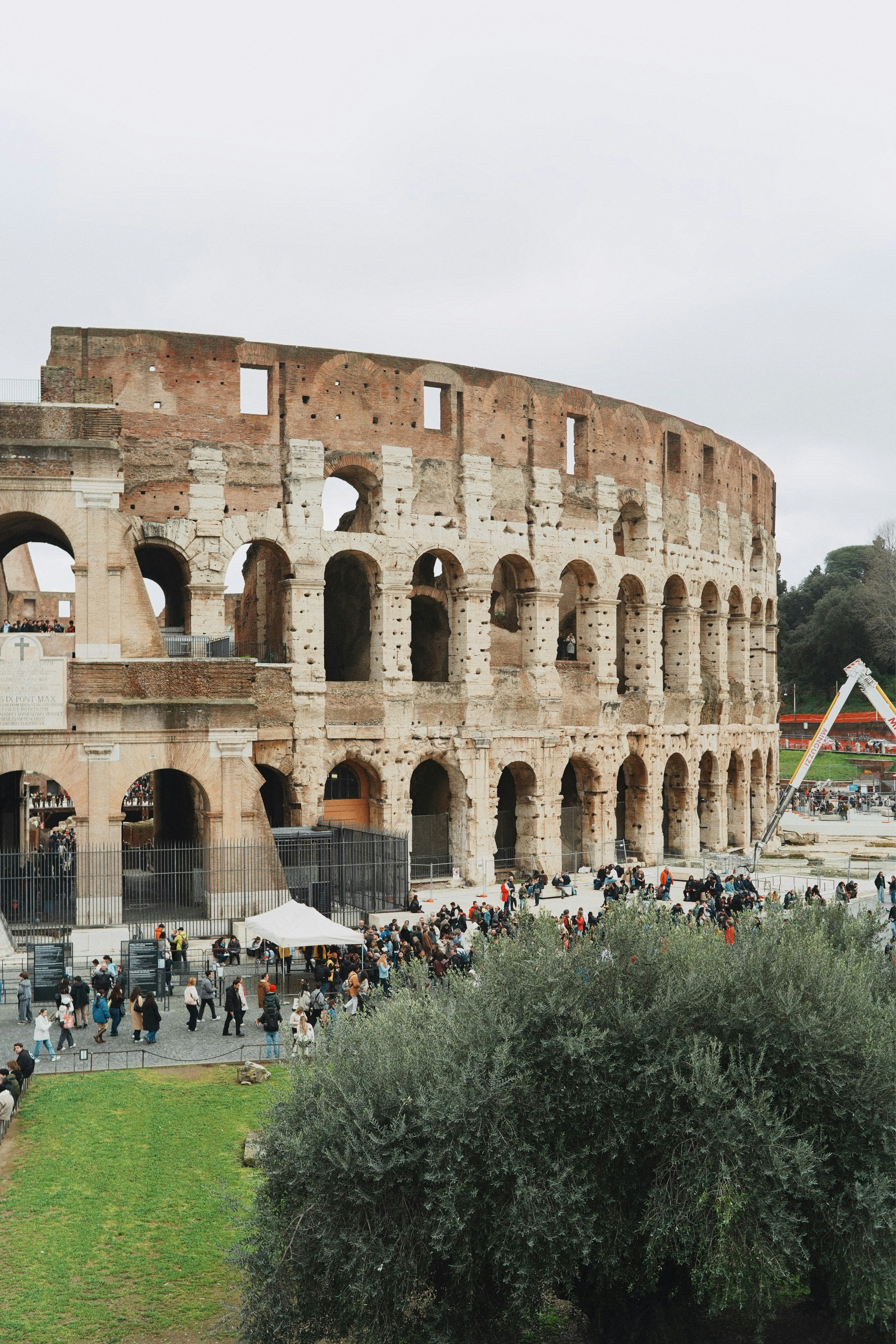 Ancient Colosseum by the Riverside: A Quiet Moment with Visitors
