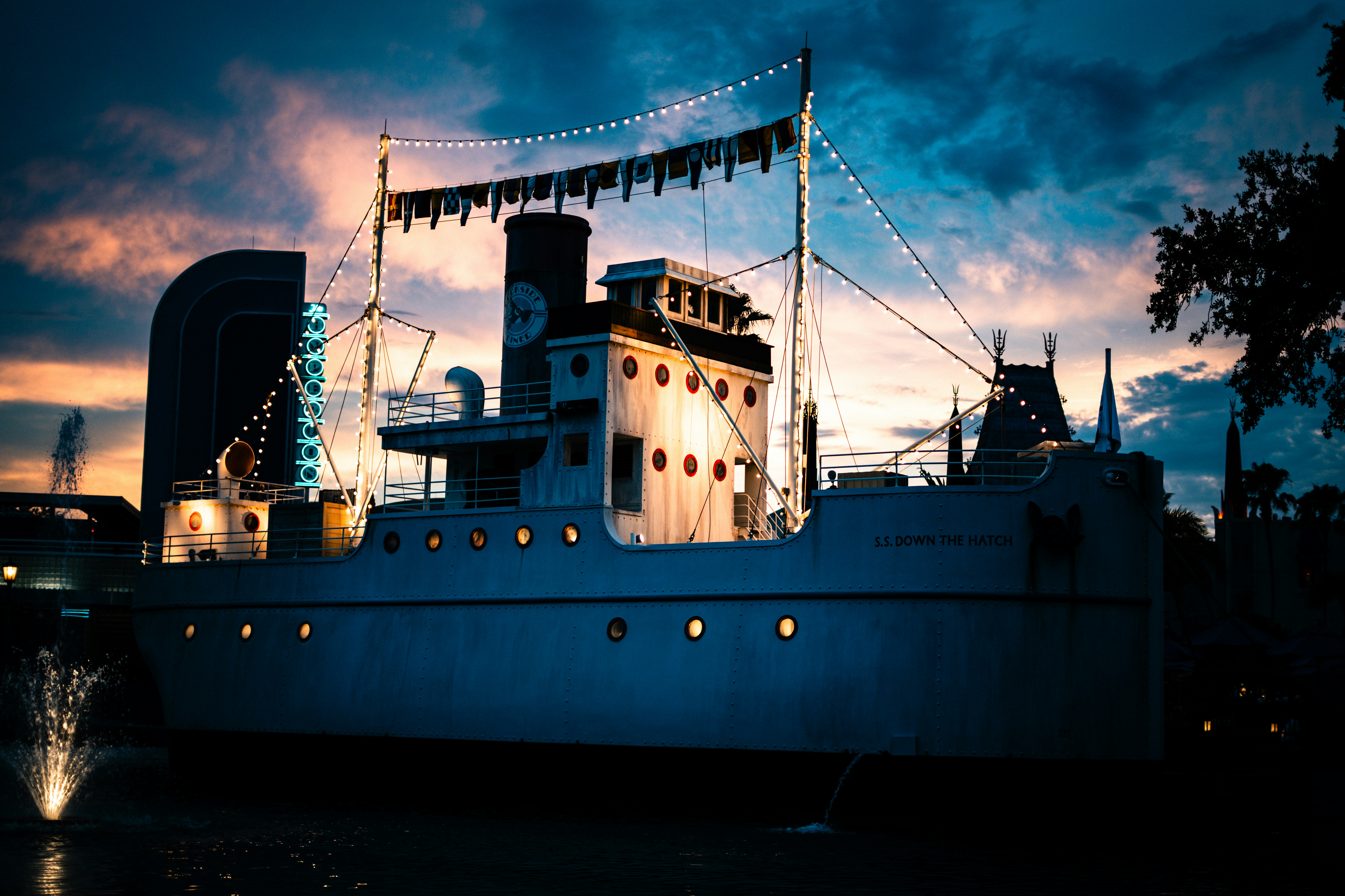 Luminous Midnight Cruiser: A Festive Vessel Awakens at Dusk