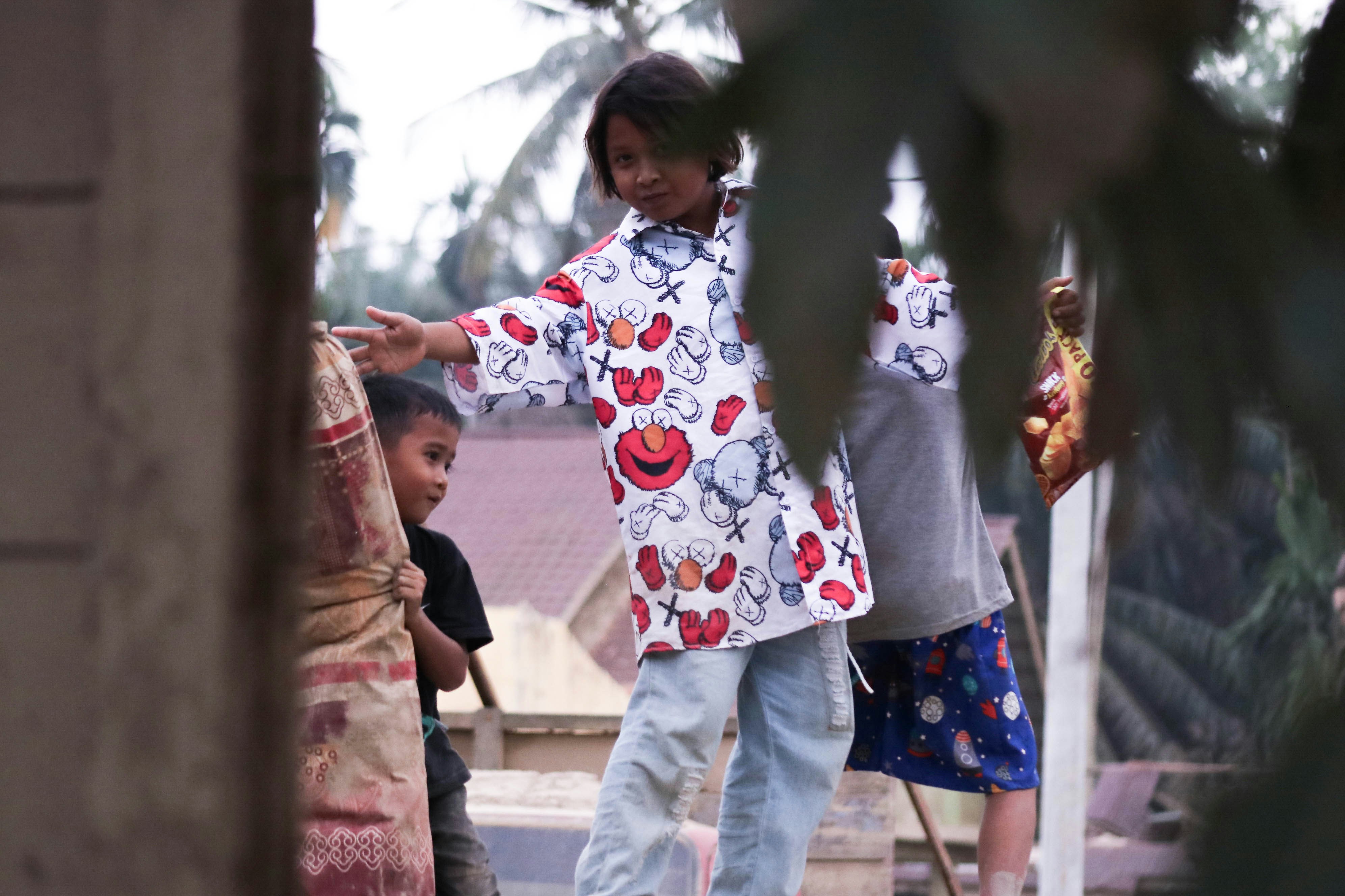 Youthful Outstretched Gaze: A Moment in the Street