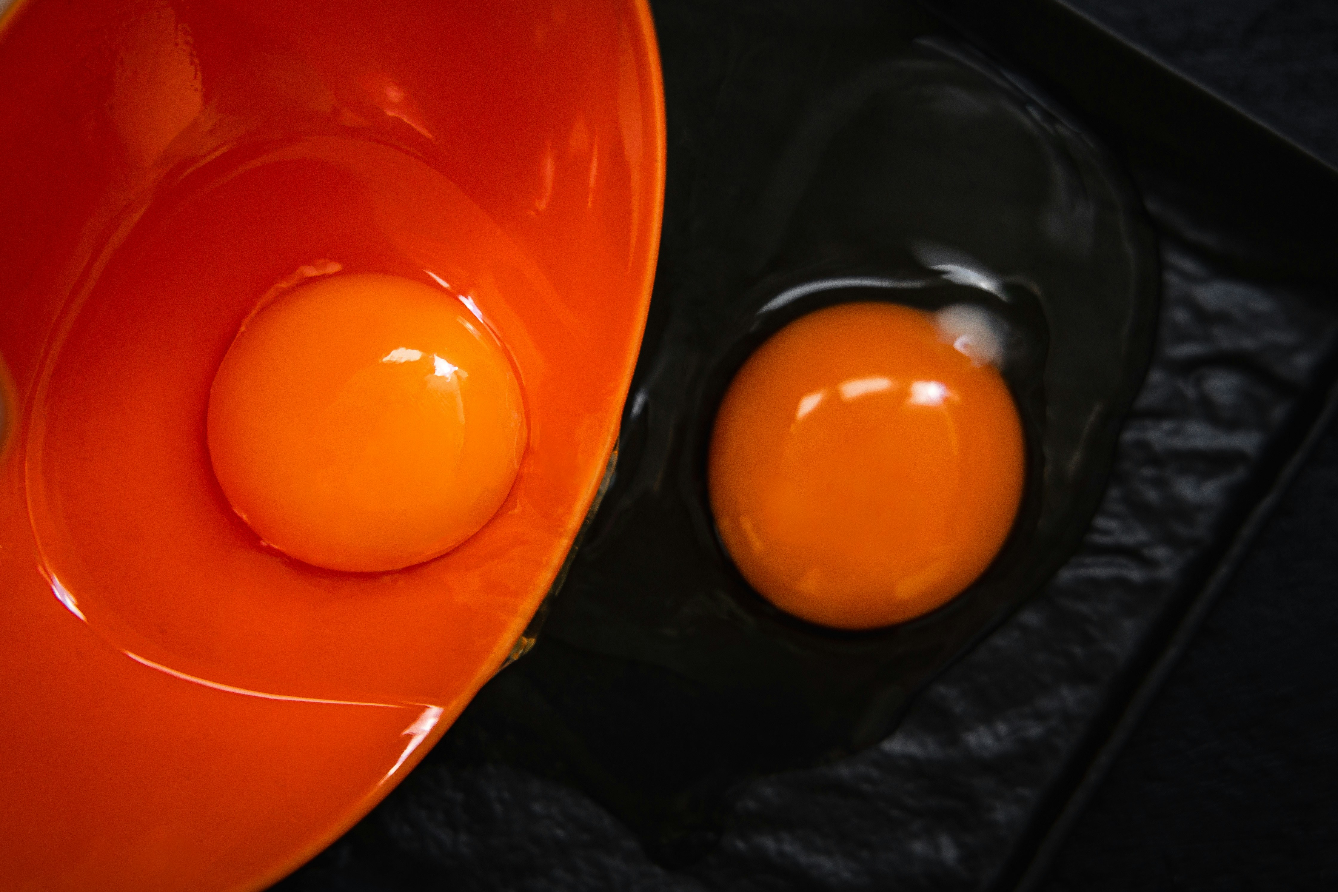 Bright Orange Yolk Duo: A Close-Up of Breakfast Color and Form
