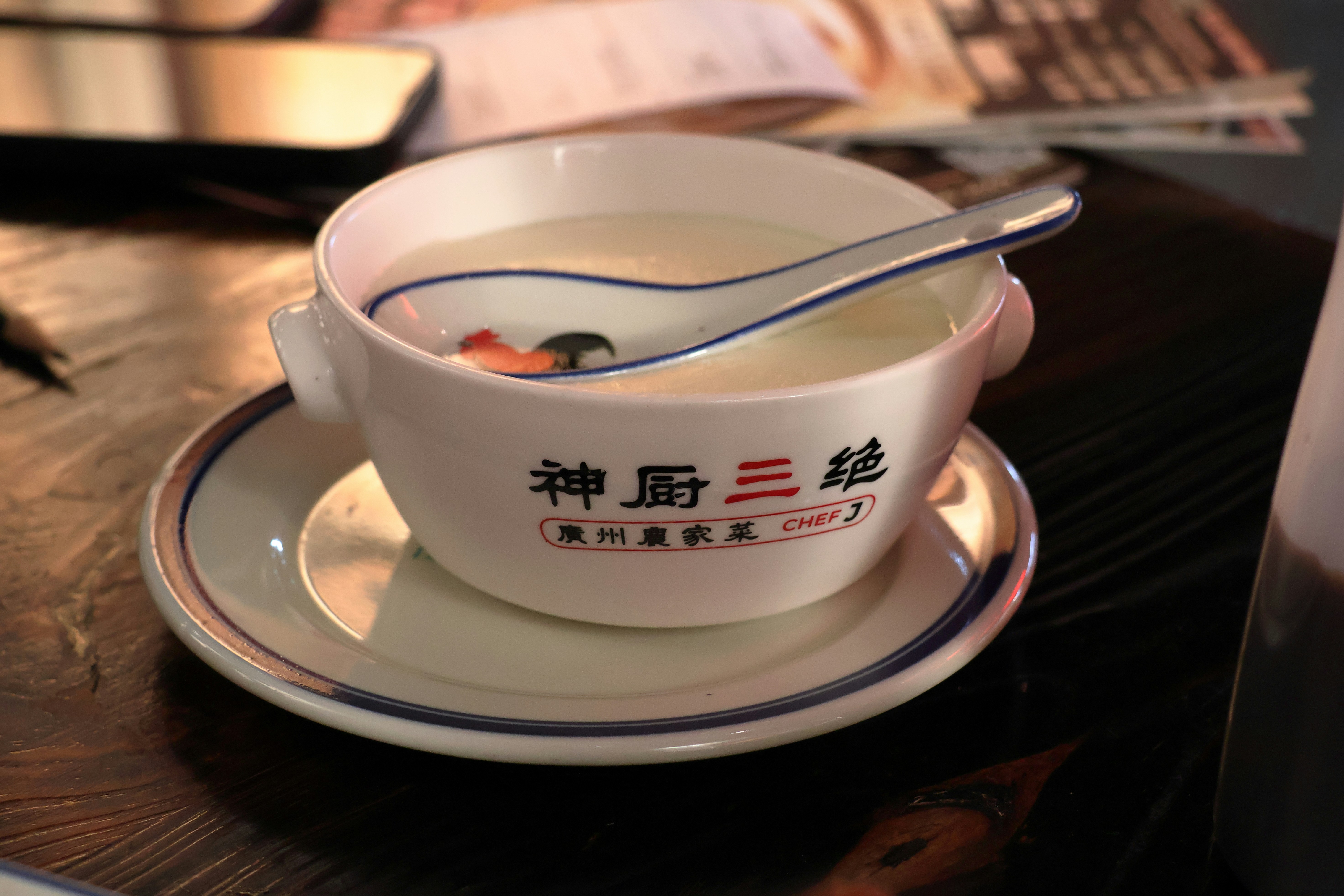 Ceramic Soup Bowl on a Dark Wooden Table