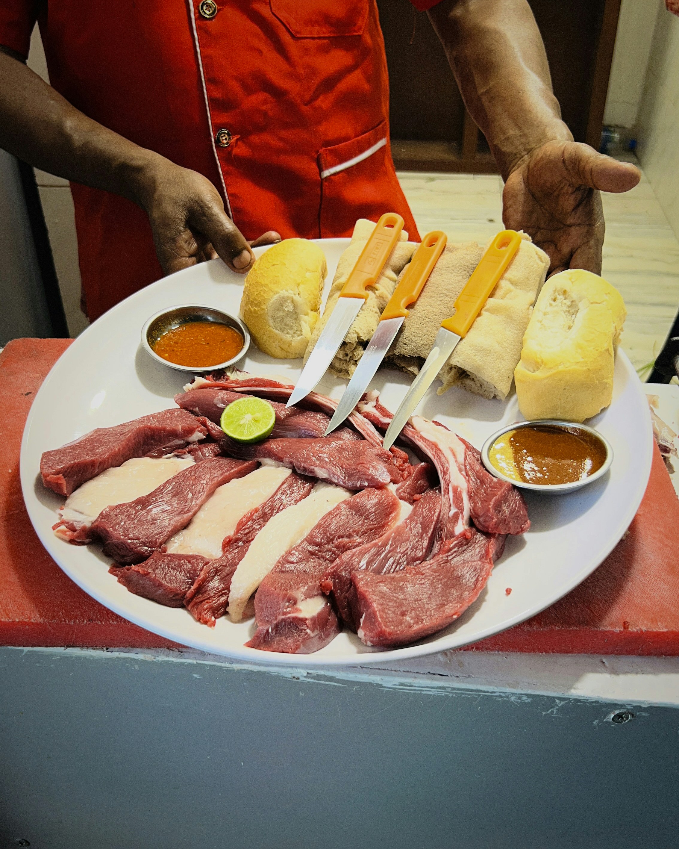 Sizzling Plate of Prime with Bread Knives