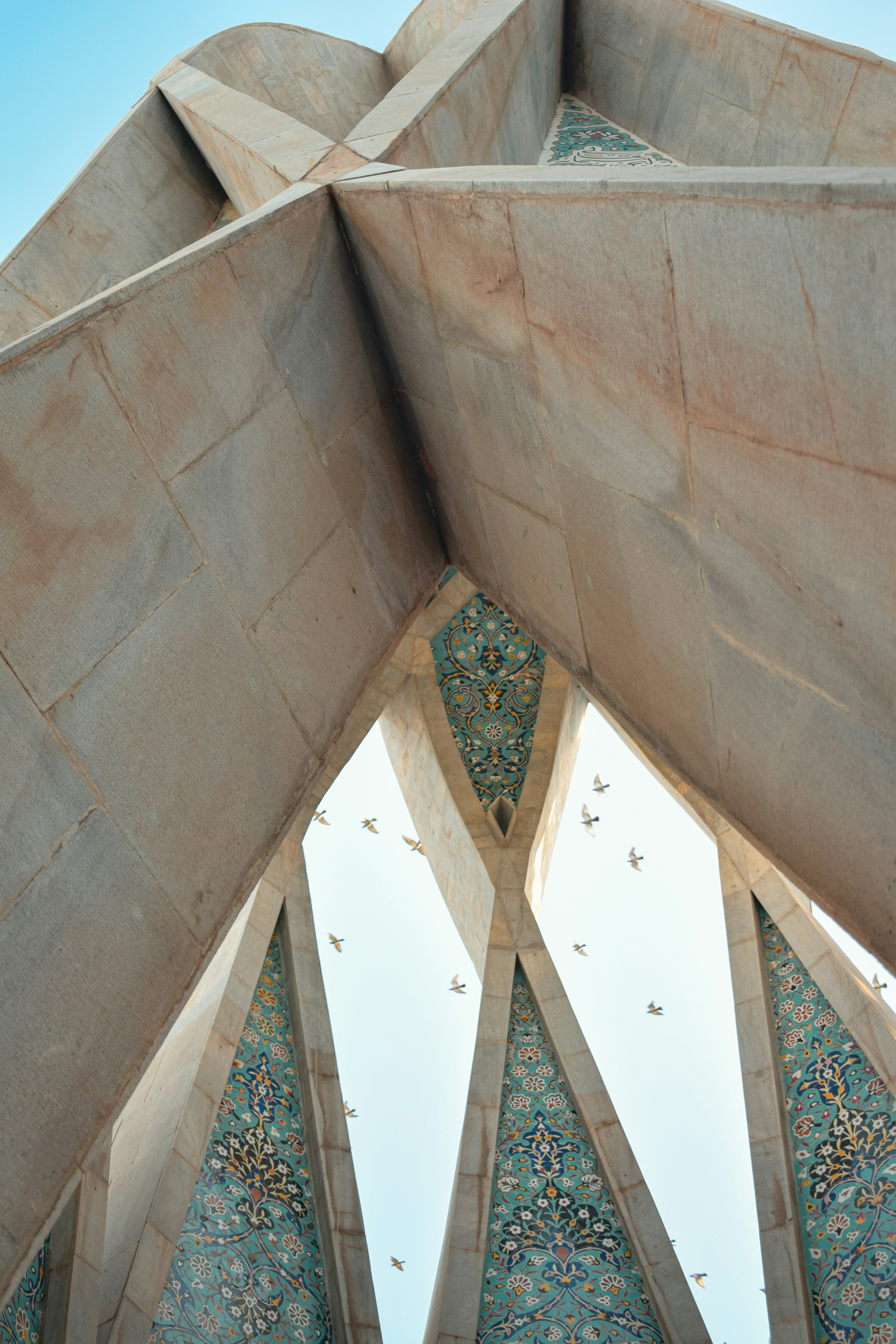 Rising Arches of Turquoise: A Skin of Tiles and Concrete