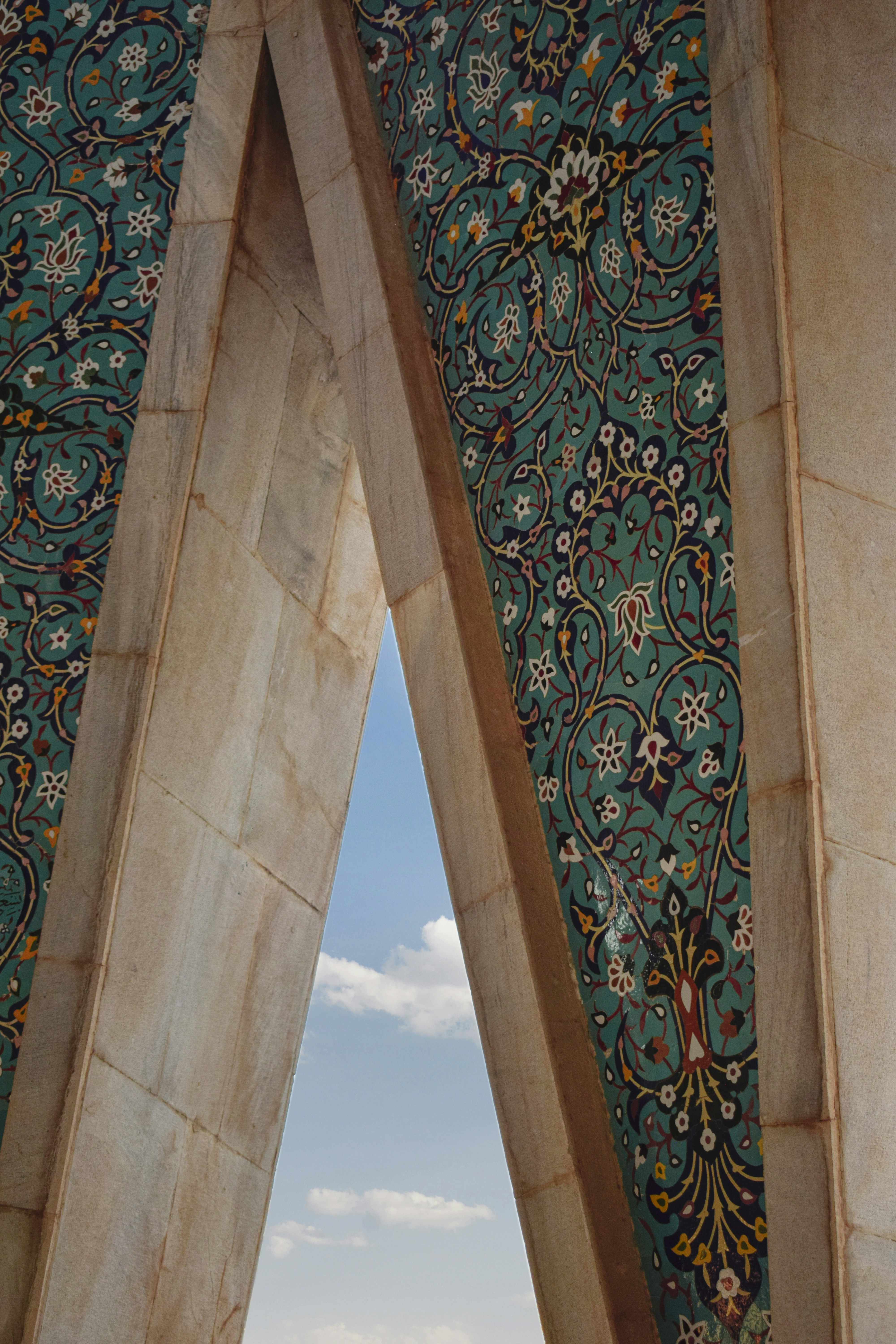Archway Vista: A Sky-Framed Opening Through Ornate Tiles