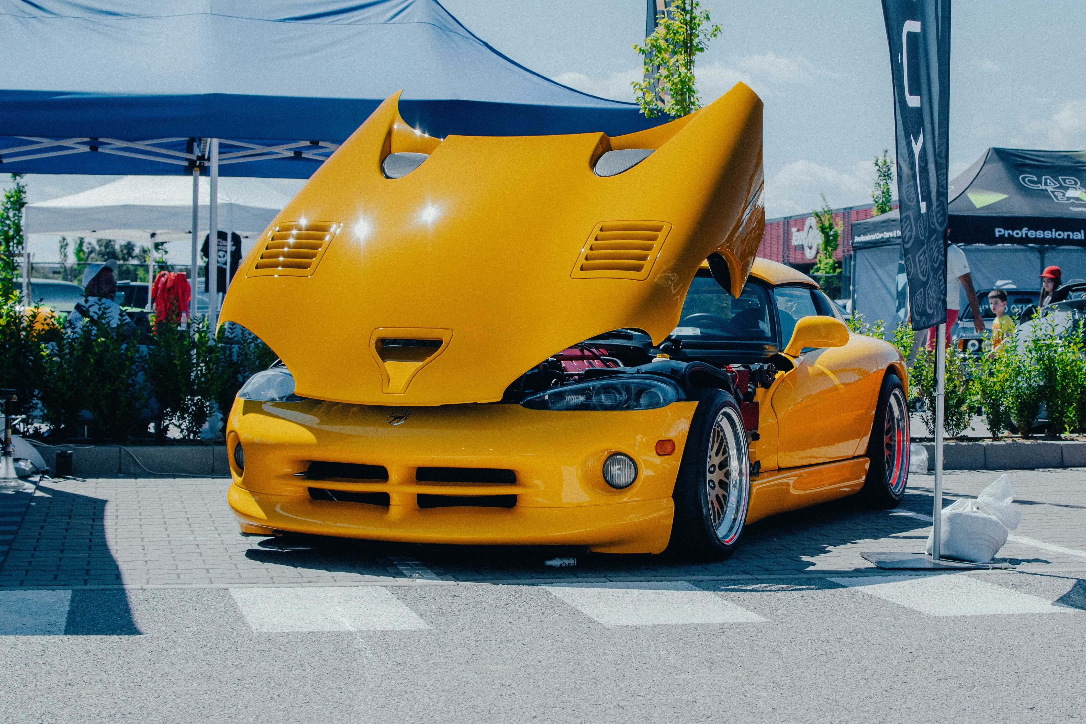 Orange Dragon: Hood Raised, Mid-Engine Power on Display