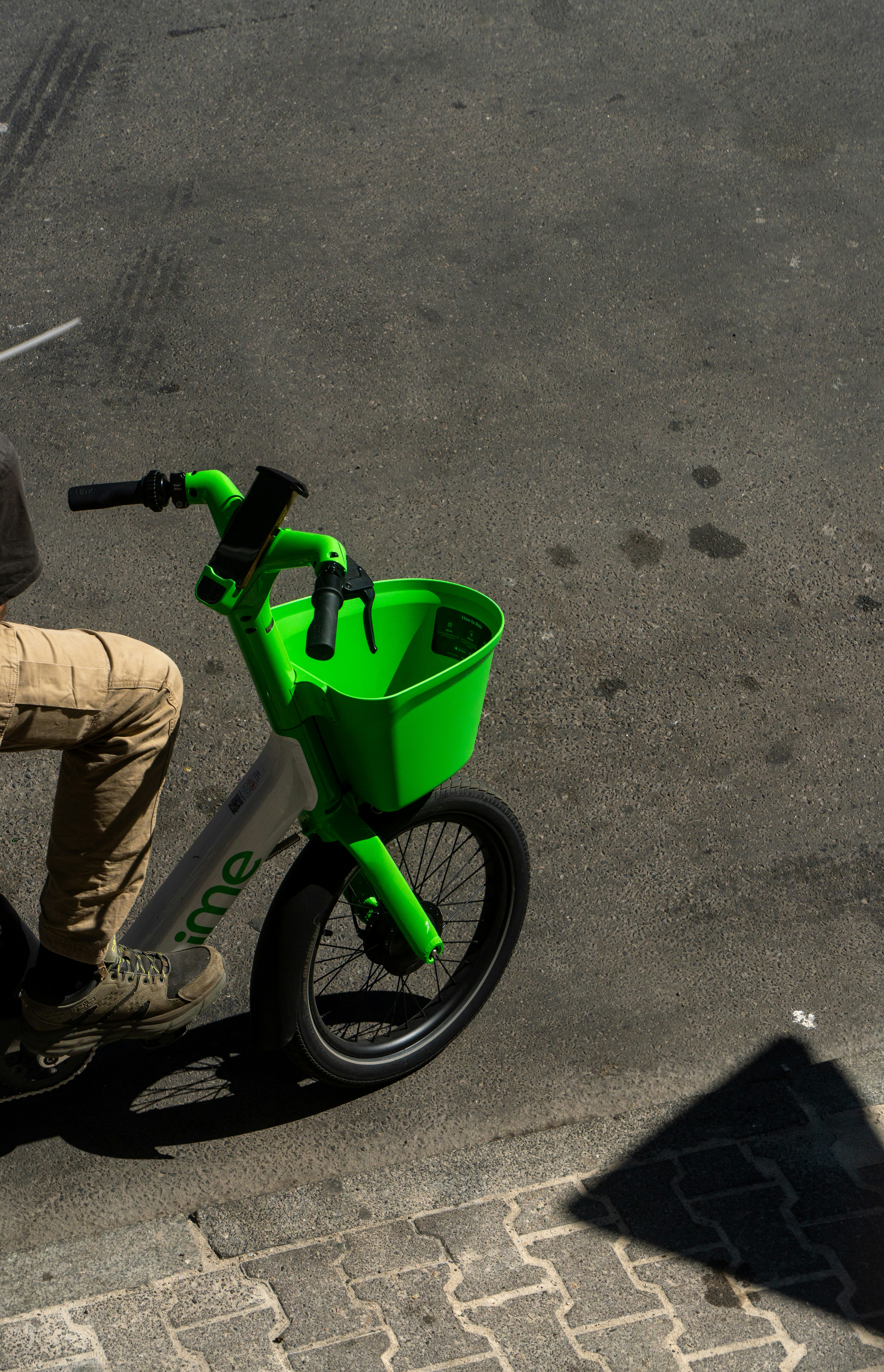 Bright Green Scooter Stands Out on the Urban Street