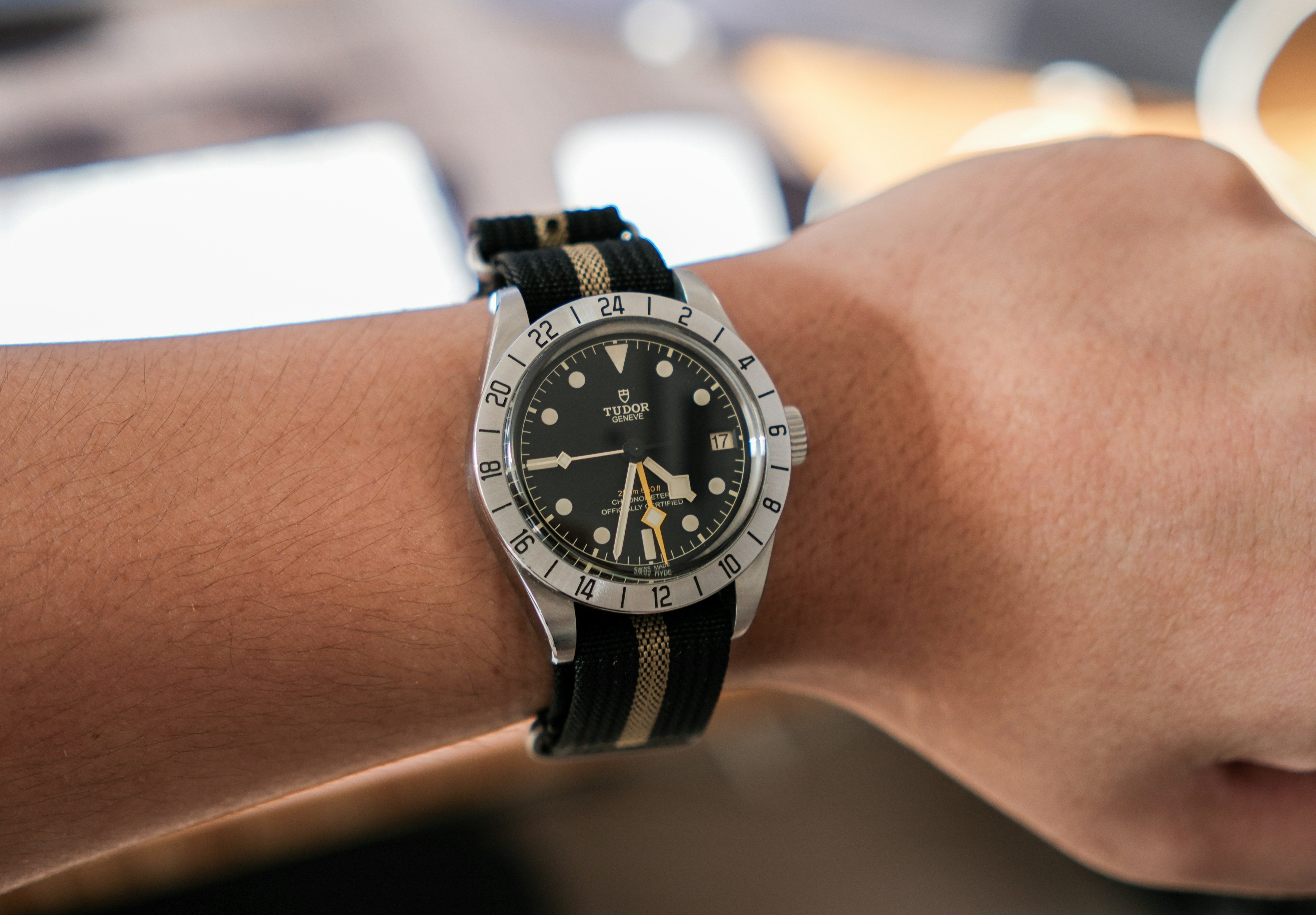 Timekeeper on Stretch: A Wristwatch anchored by a striped strap