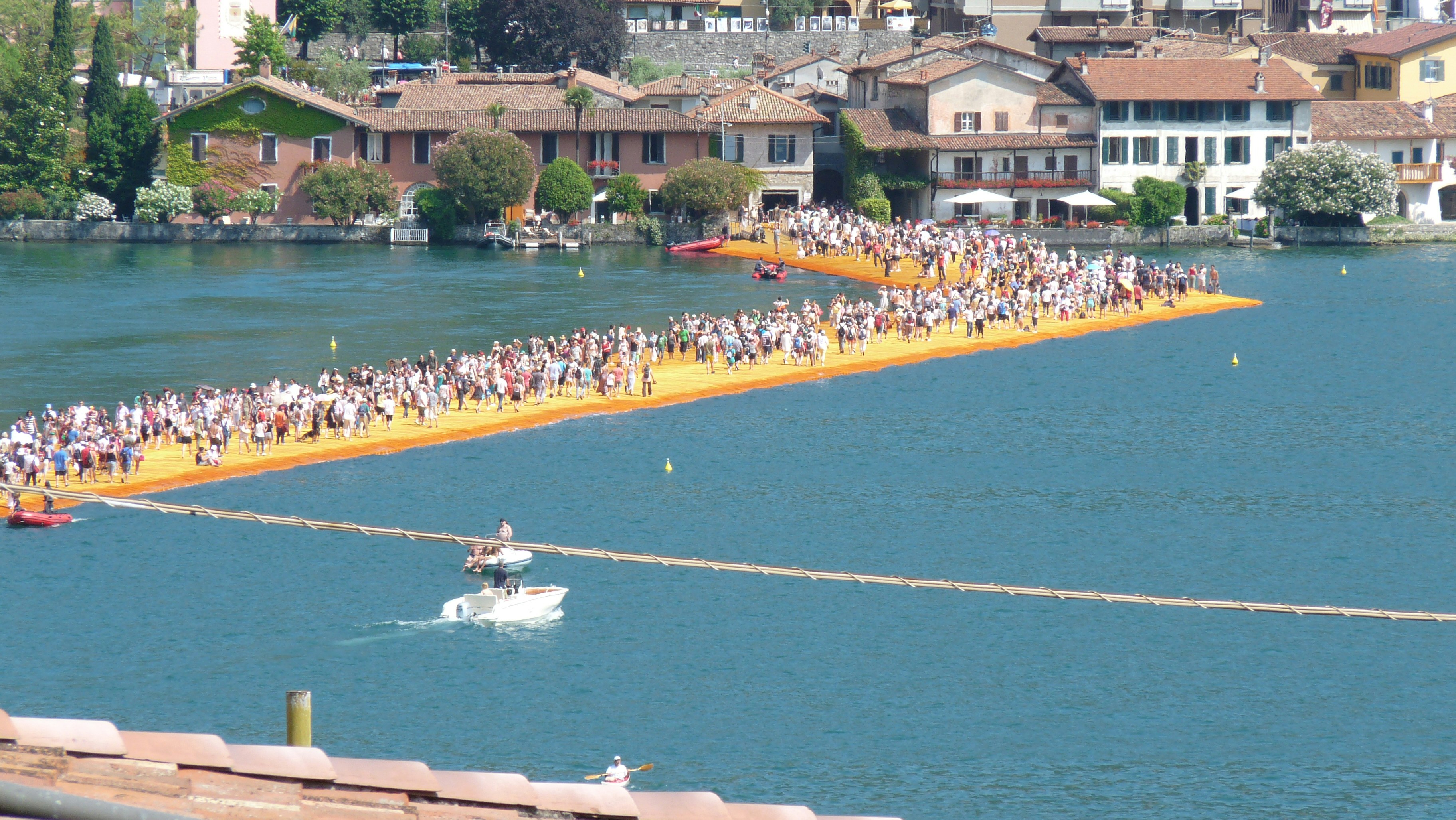 Crowd of Marathoners on a Floating Runway Across a Lake