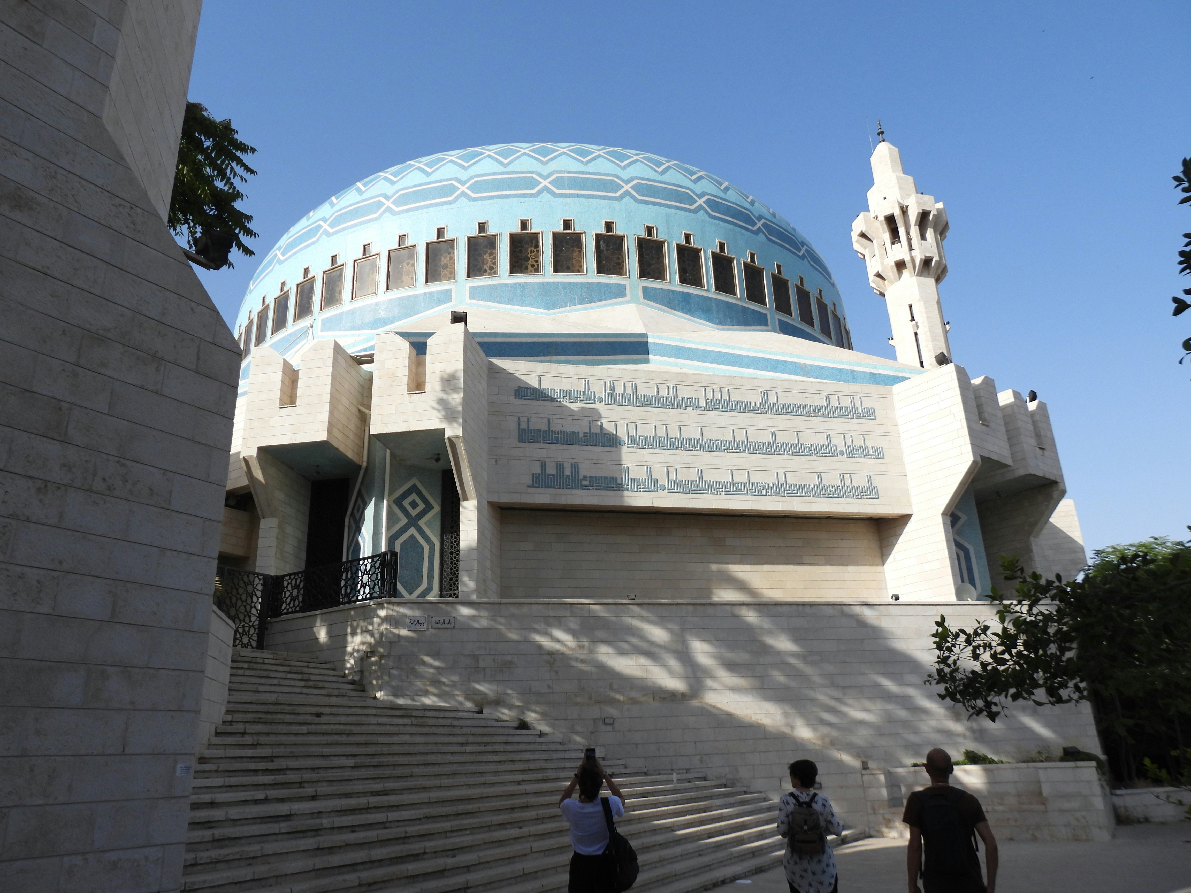 Blue-domed Mausoleum rising above sunlit stone steps