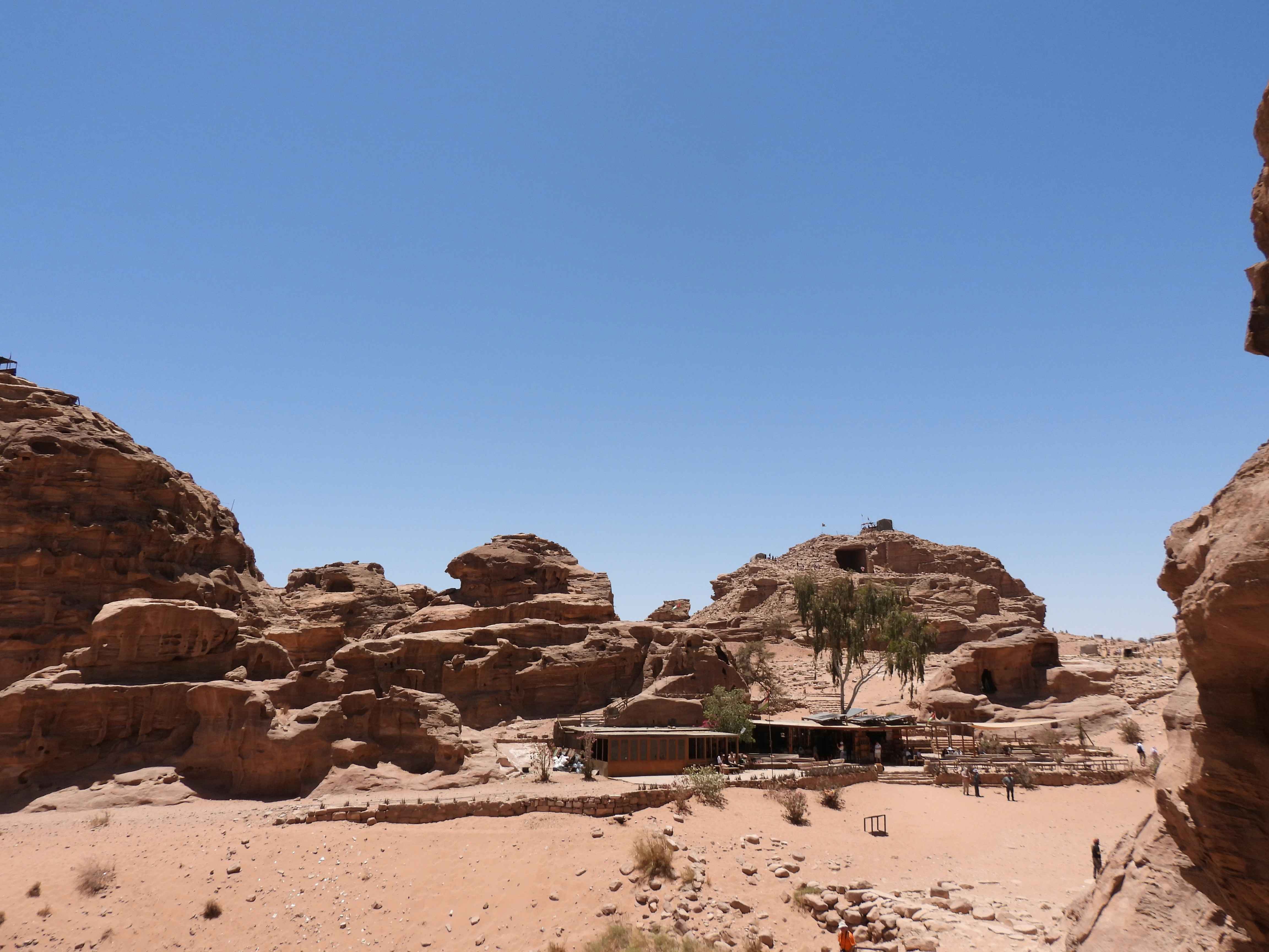 Desert Canyon Settlement Beneath Clear Sky