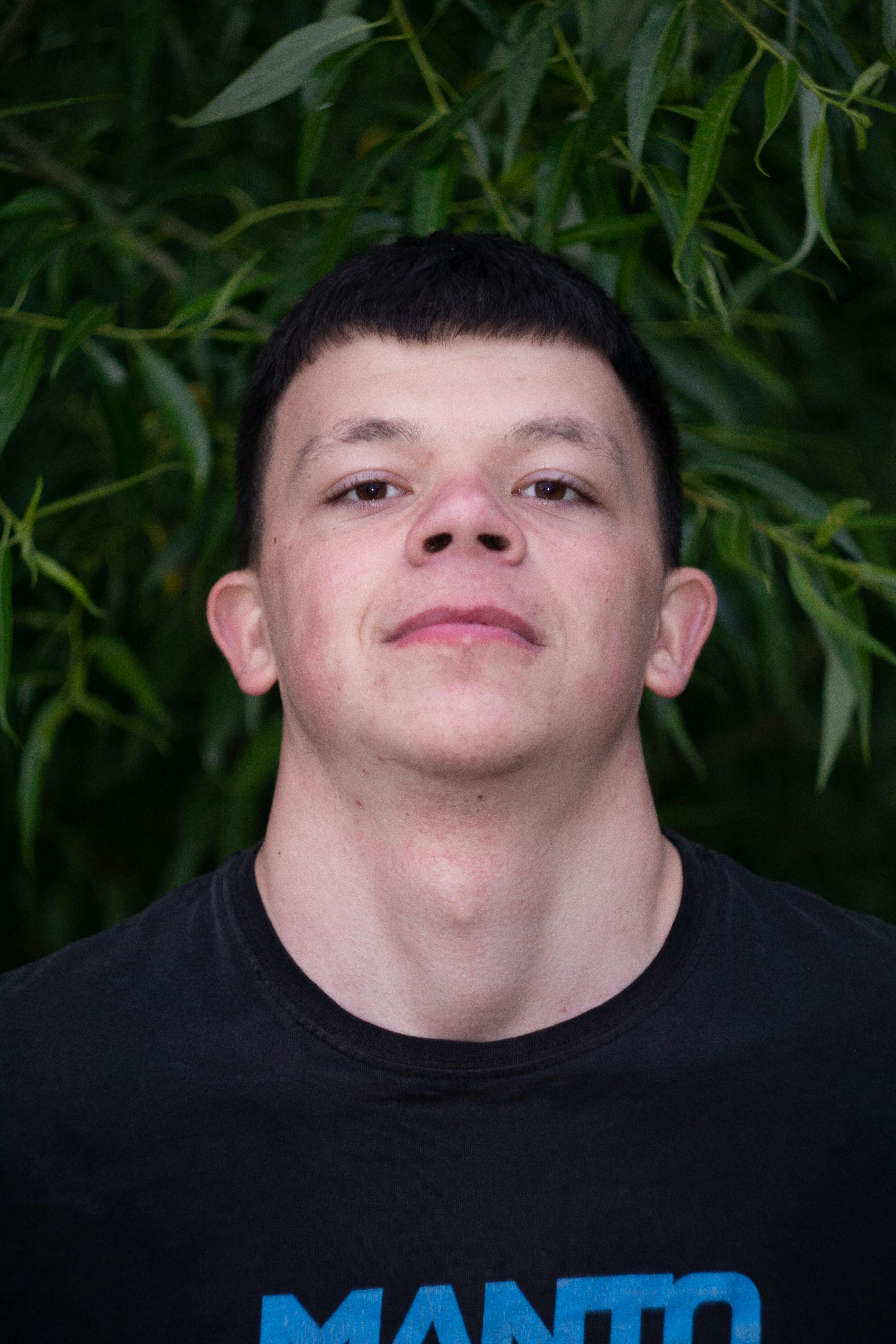 Upward Gaze: A Quiet Portrait framed by Greenery